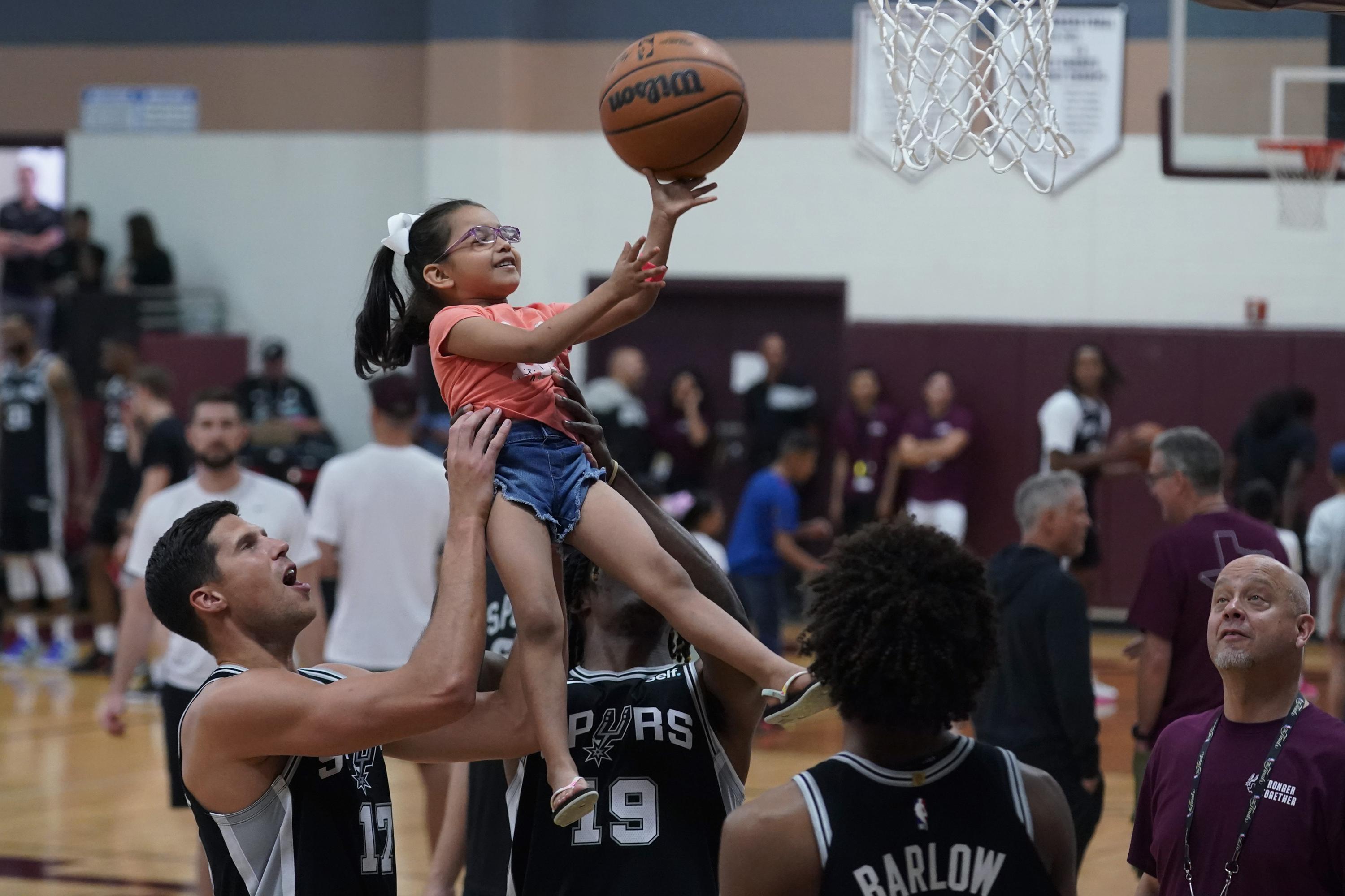 Spurs practice, fair brings a bit of joy to Uvalde, Texas | AP News
