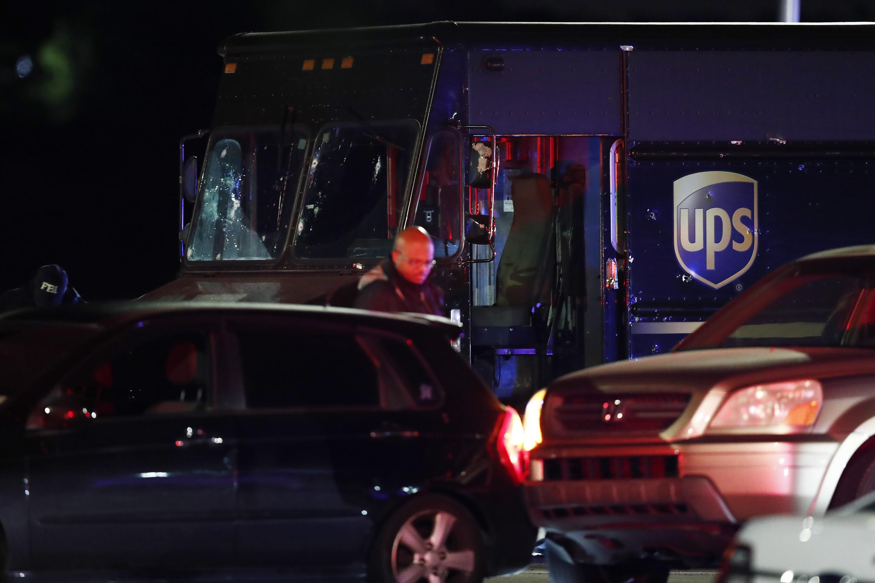 Family of UPS driver slain in police shootout files lawsuit | AP News