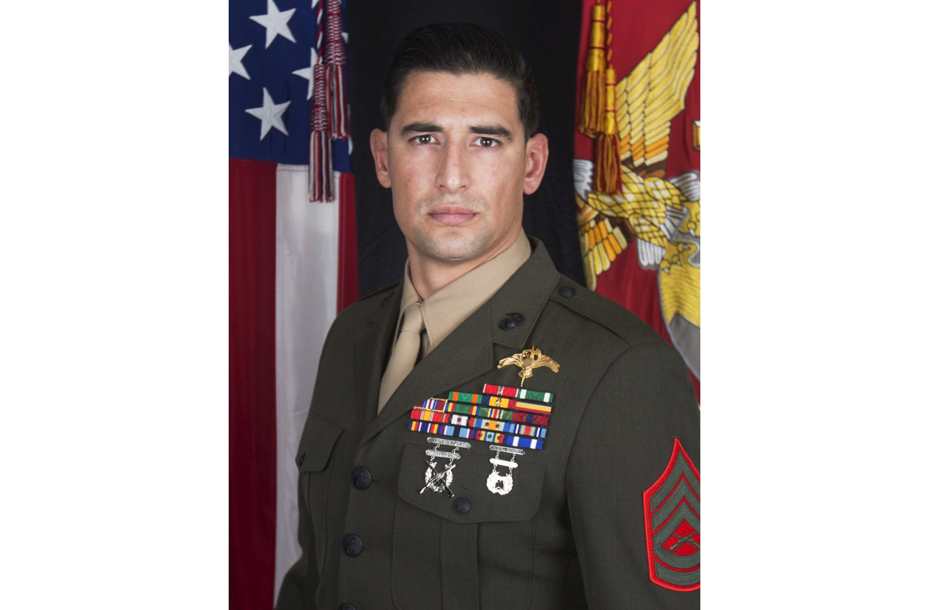 Thousands participate in memorial parade for fallen Marine | AP News