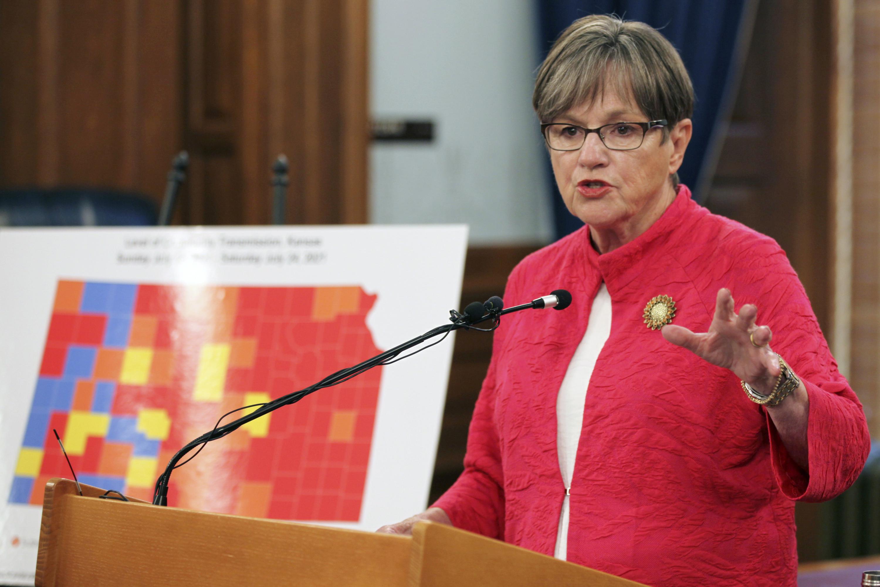 Kansas governor requiring masks for state workers, buildings | AP News