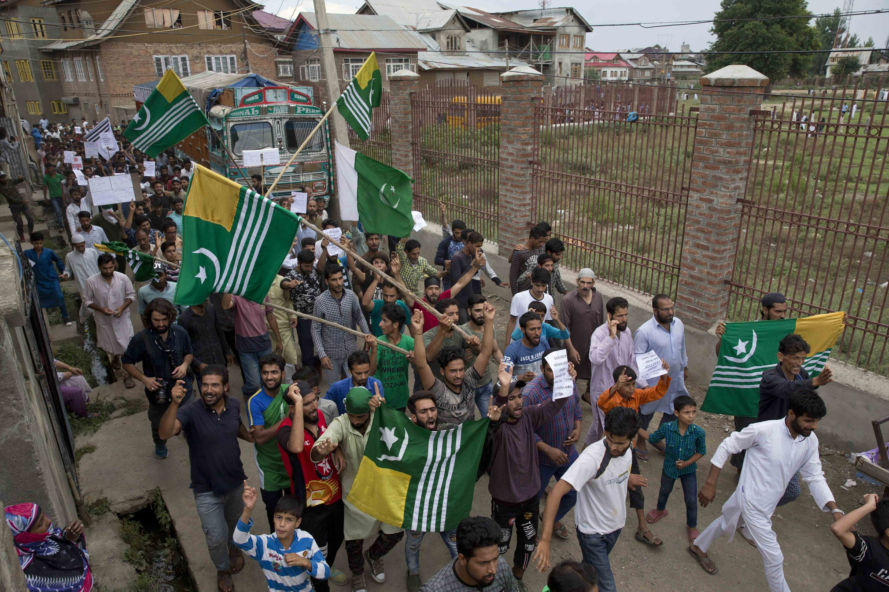 Hundreds defy restrictions, join protests in Kashmir | AP News