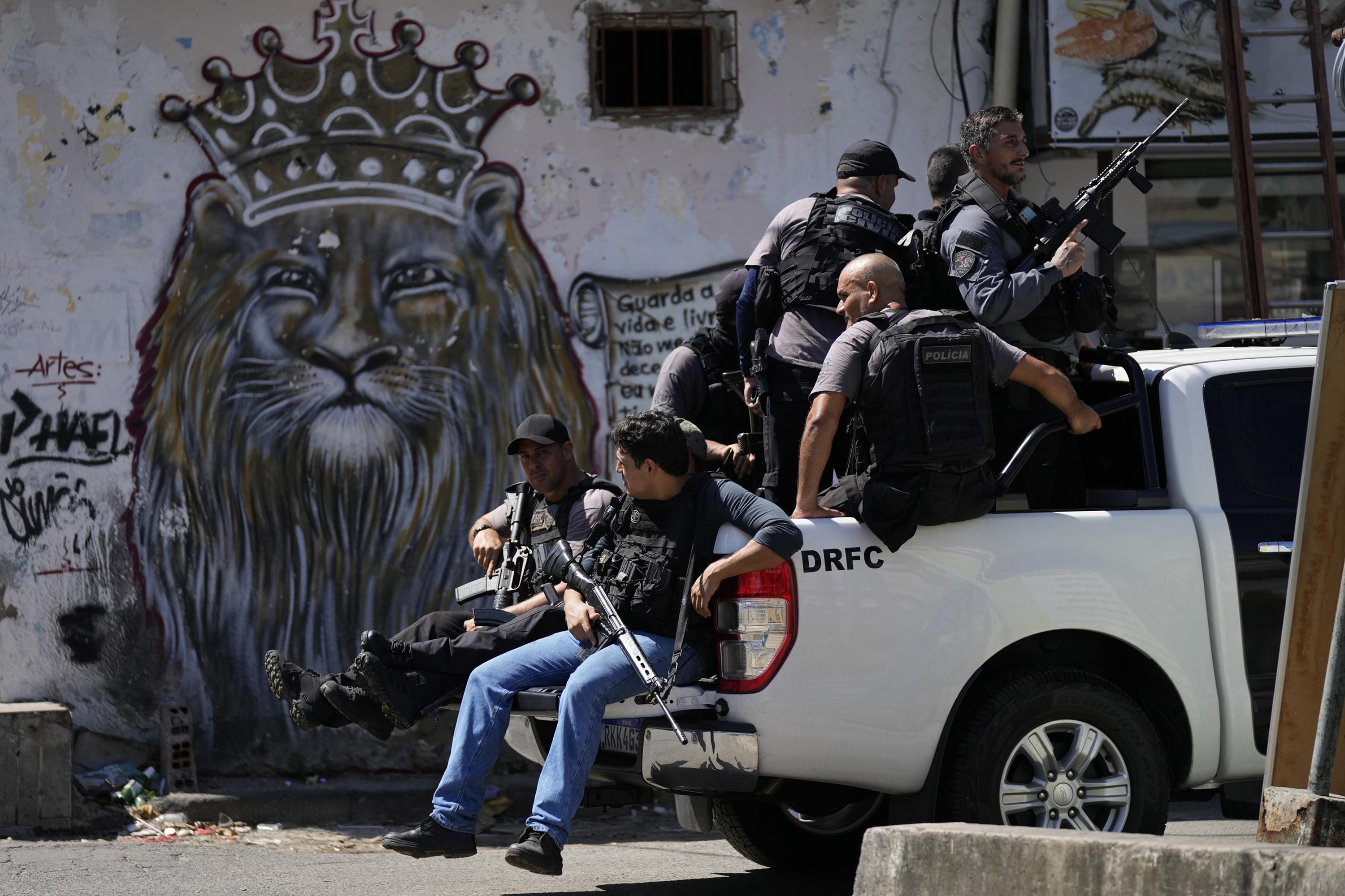 Rio de Janeiro police move to regain control of some favelas | AP News