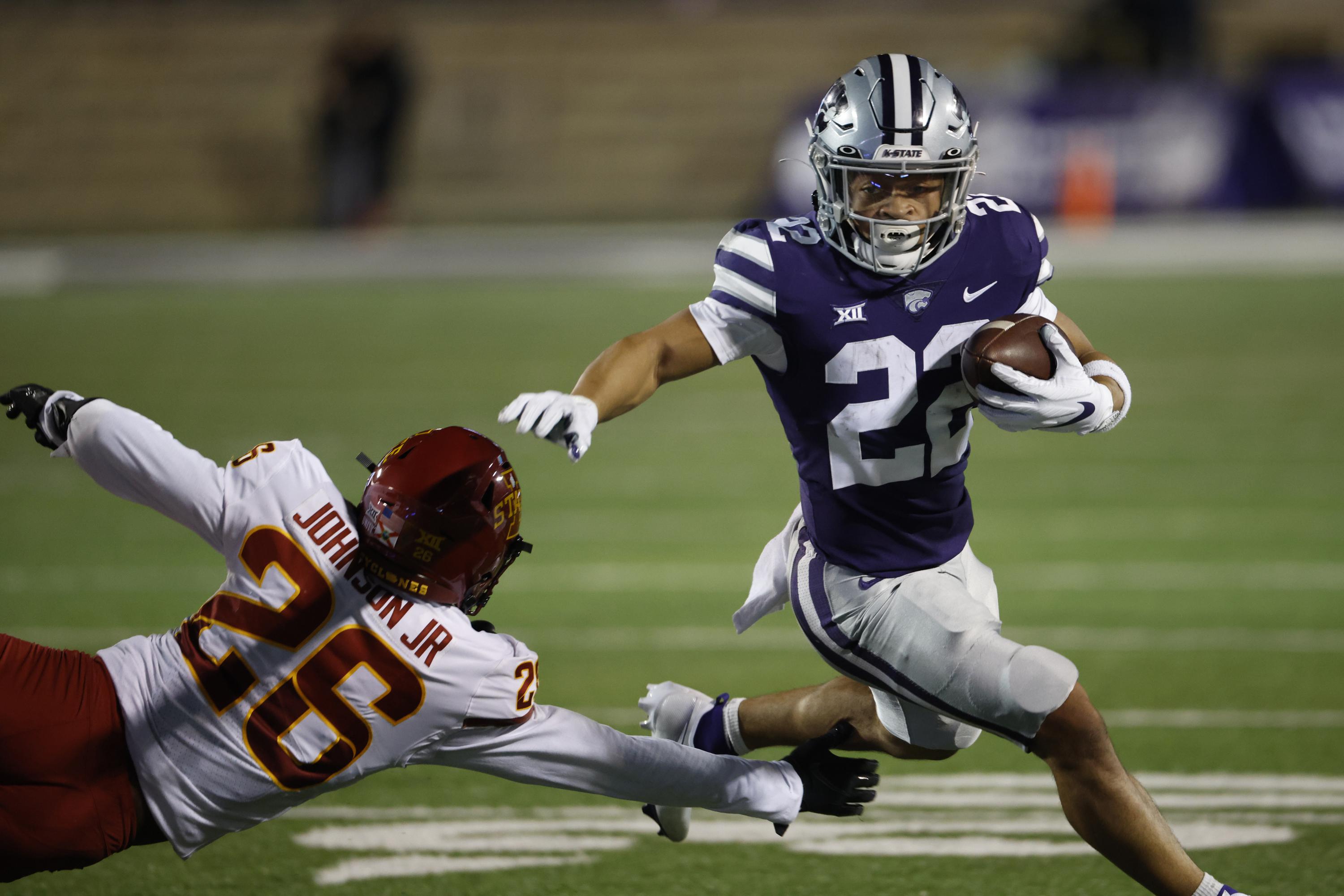 All-purpose running backs shine across Big 12, nationally | AP News