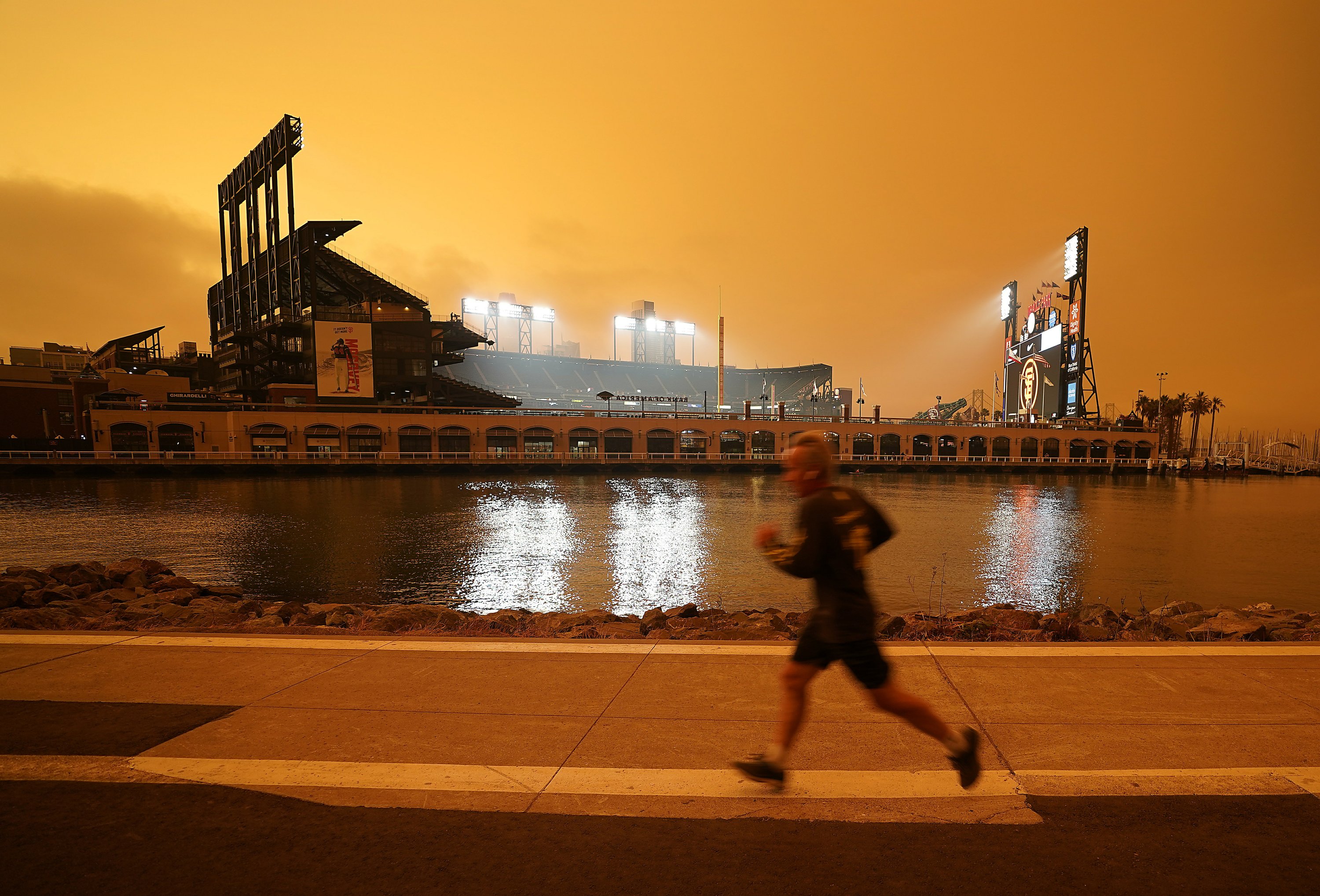 Smoke from nearby wildfires creates eerie baseball scene | AP News