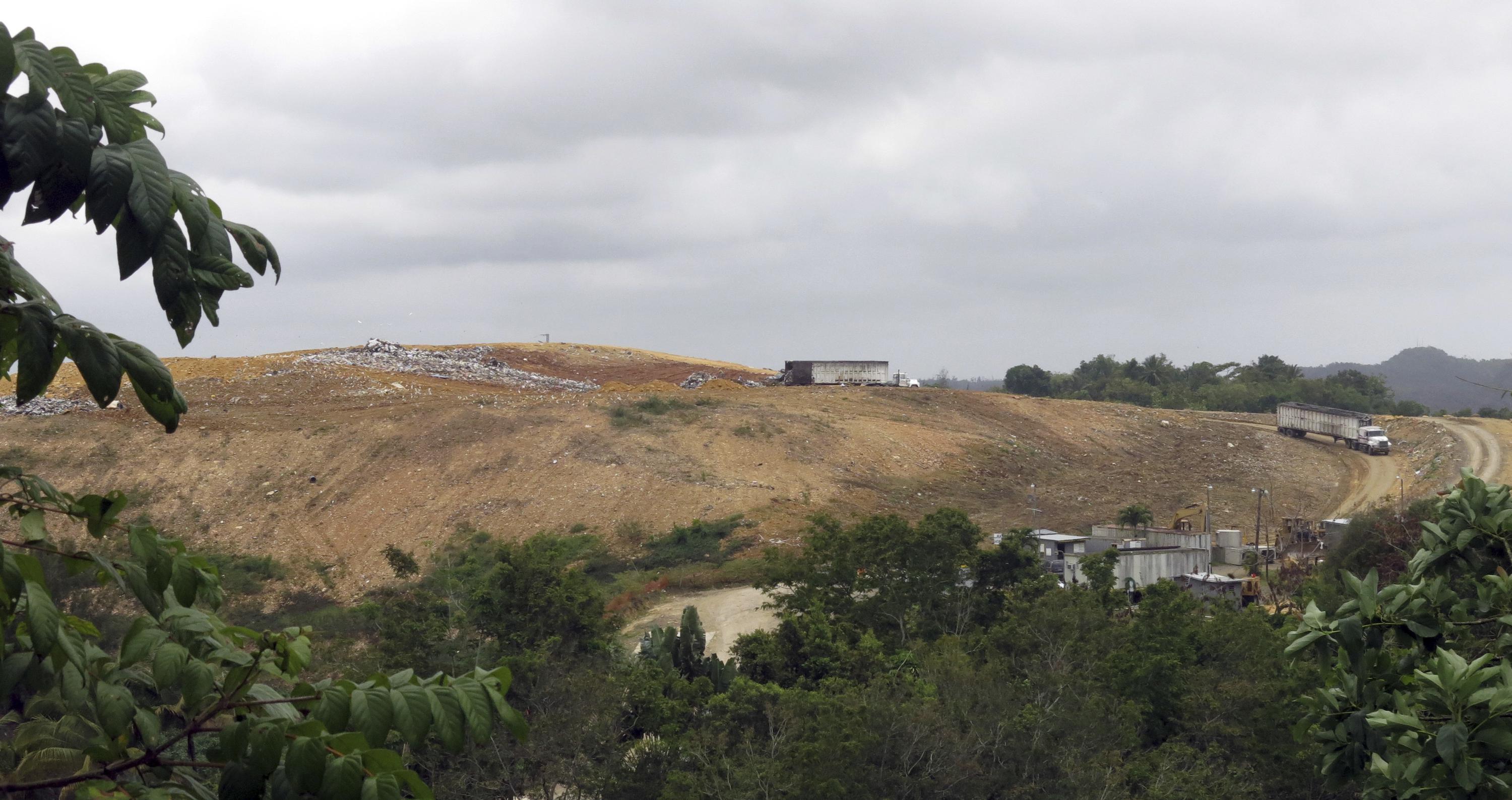Overflowing landfills choke Puerto Rico amid economic crisis | AP News