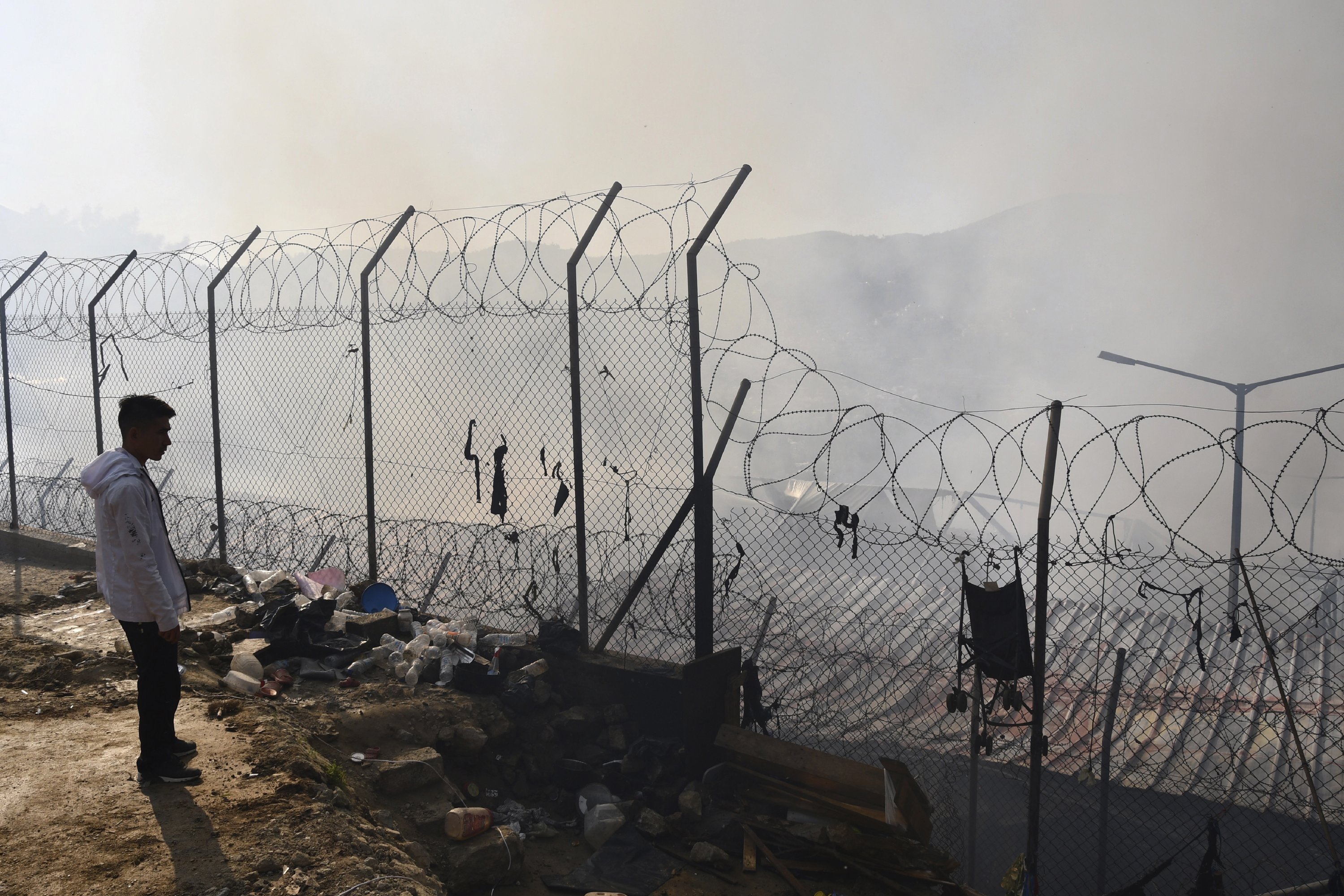 Report slams conditions in Greek migrant detention centers | AP News