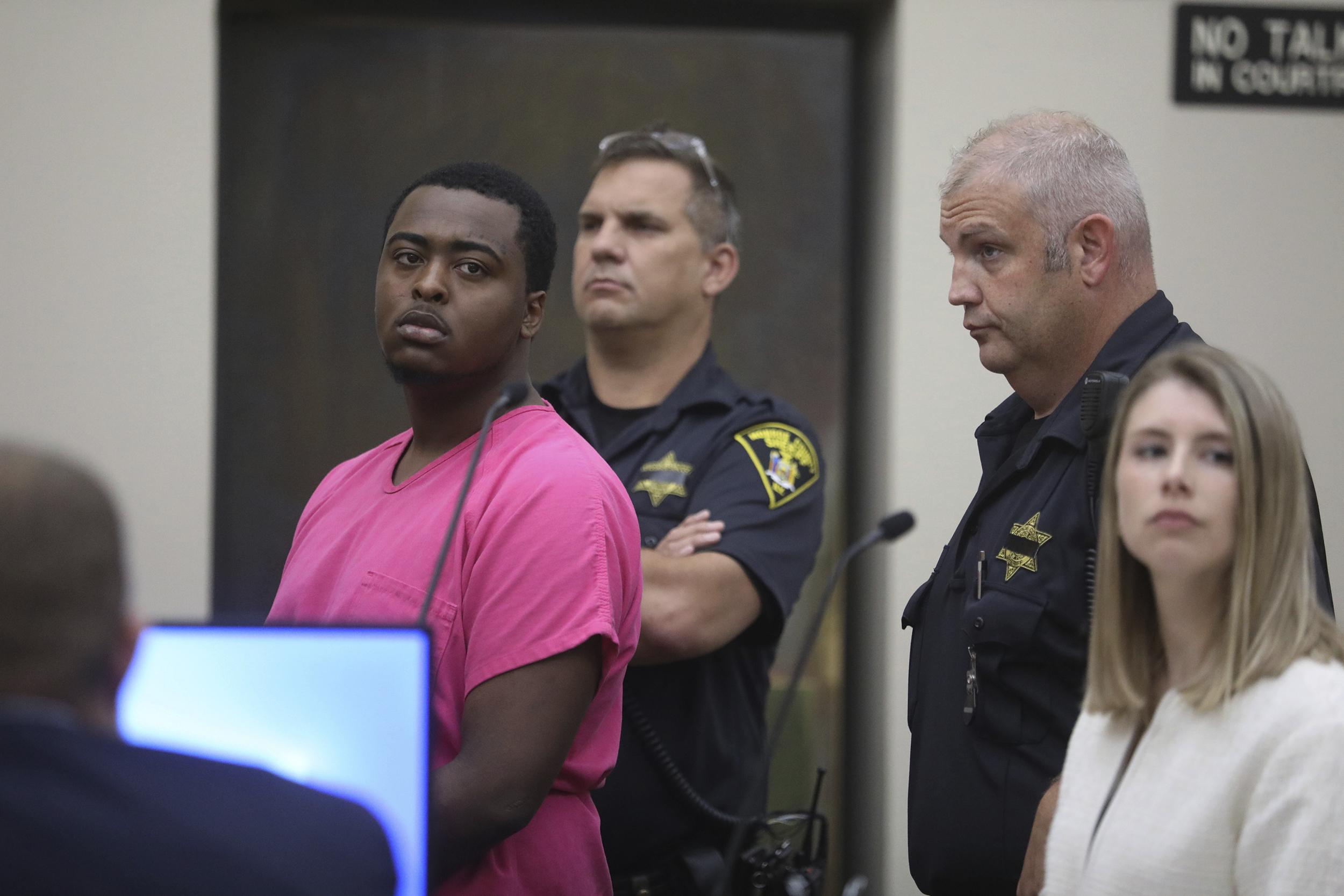 Man charged with killing Rochester officer pleads not guilty | AP News