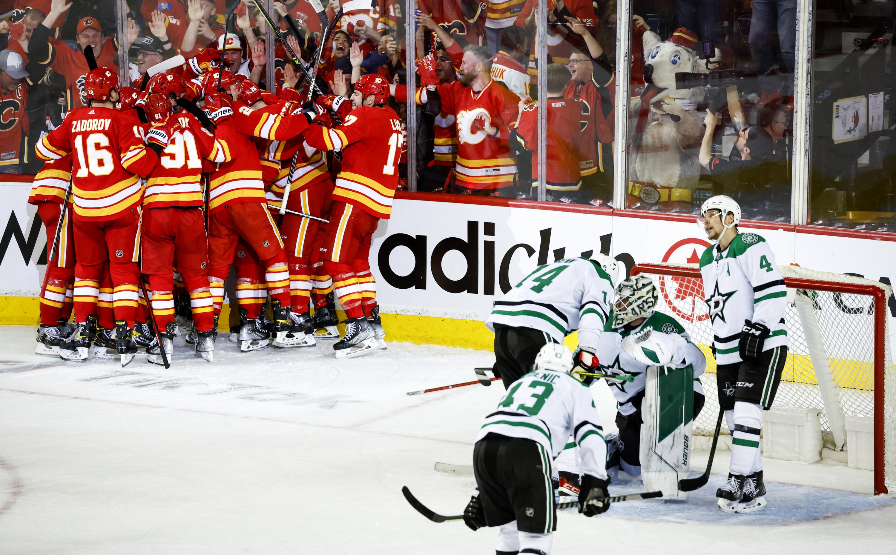 Gaudreau's OT goal gives Flames 3-2 win over Stars in Game 7 | AP News