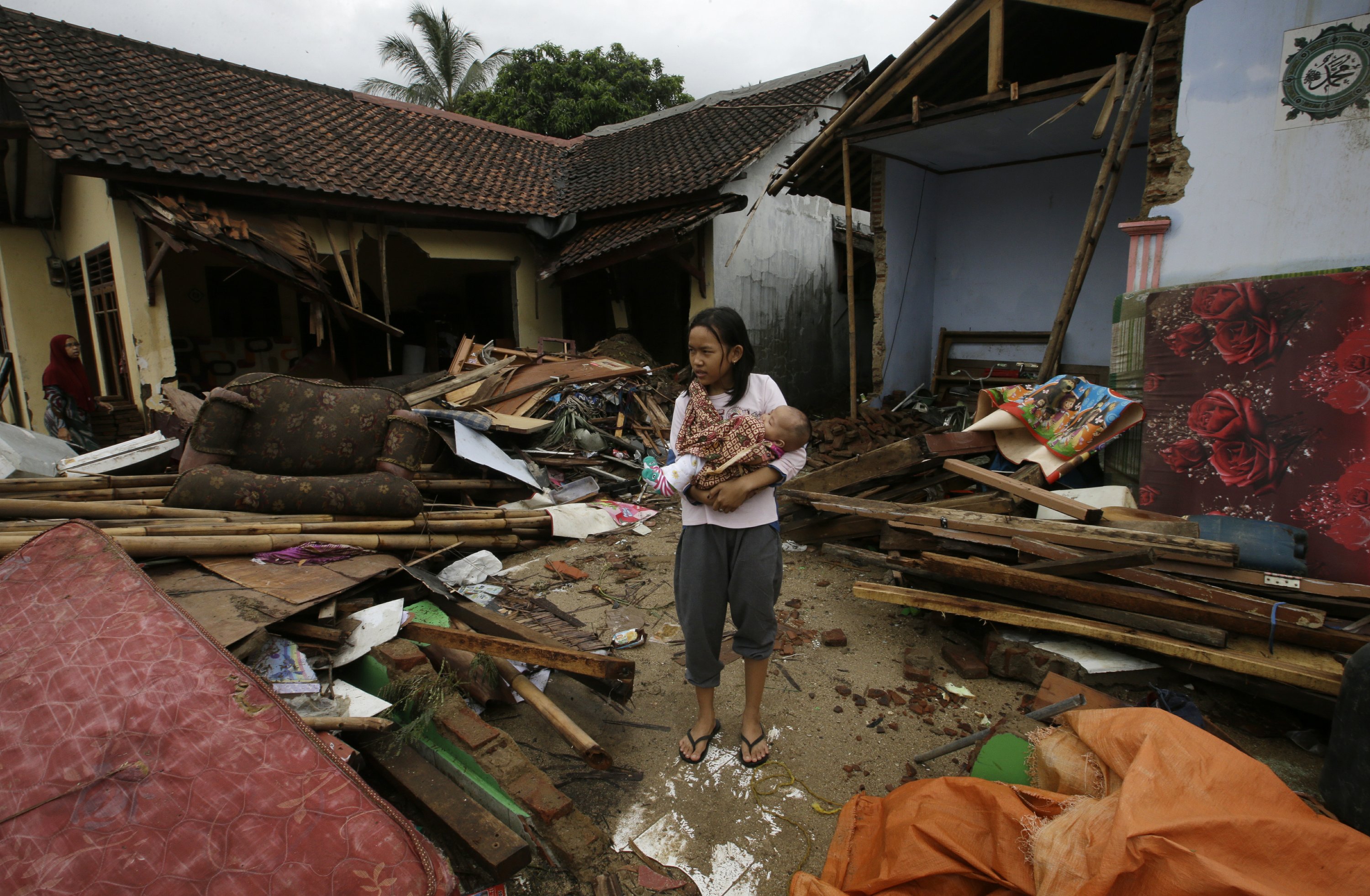 PHOTOS: Tsunami set off by volcanic eruption kills more than 200 in ...