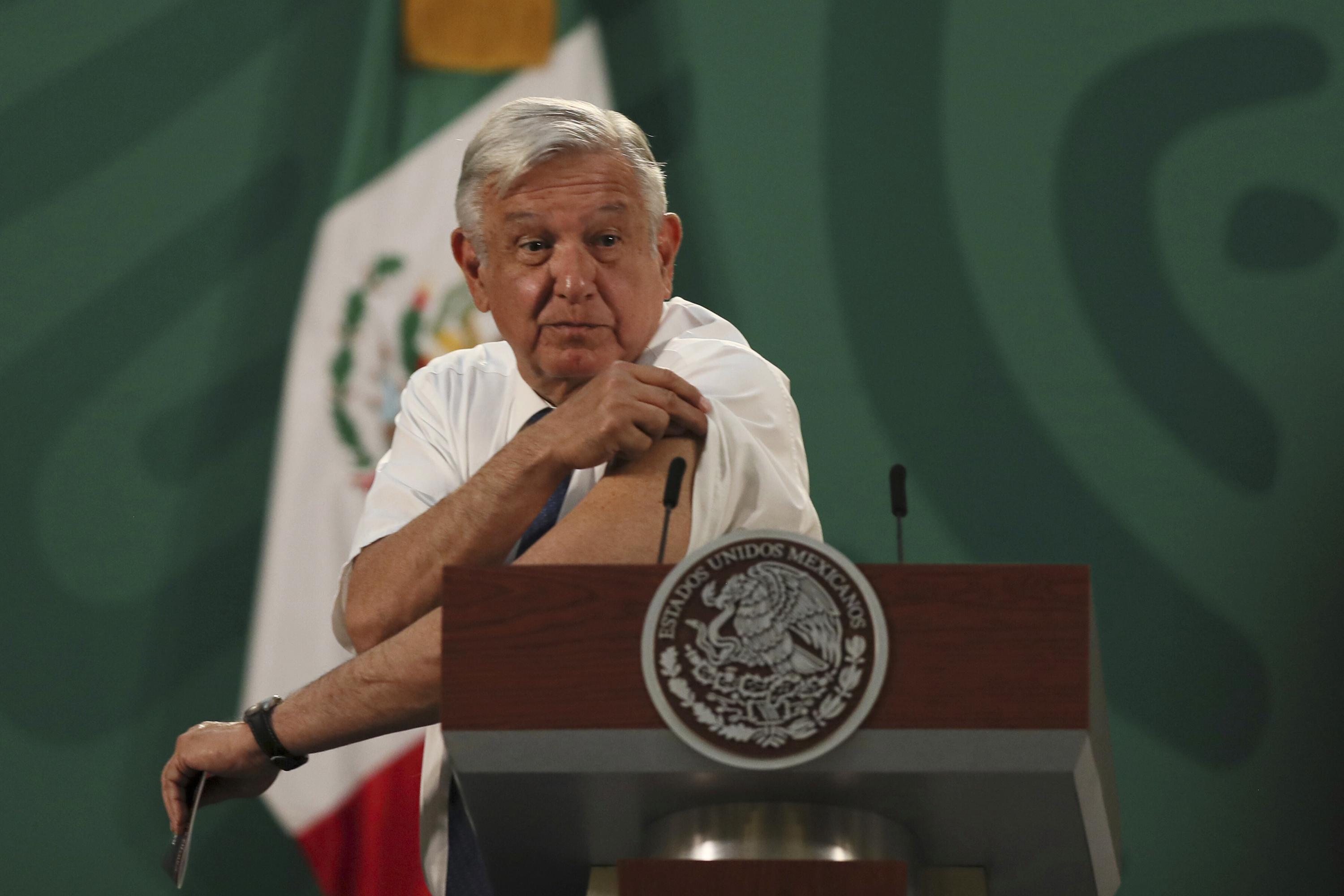 Mexican president gets COVID vaccine after waffling on shot | AP News