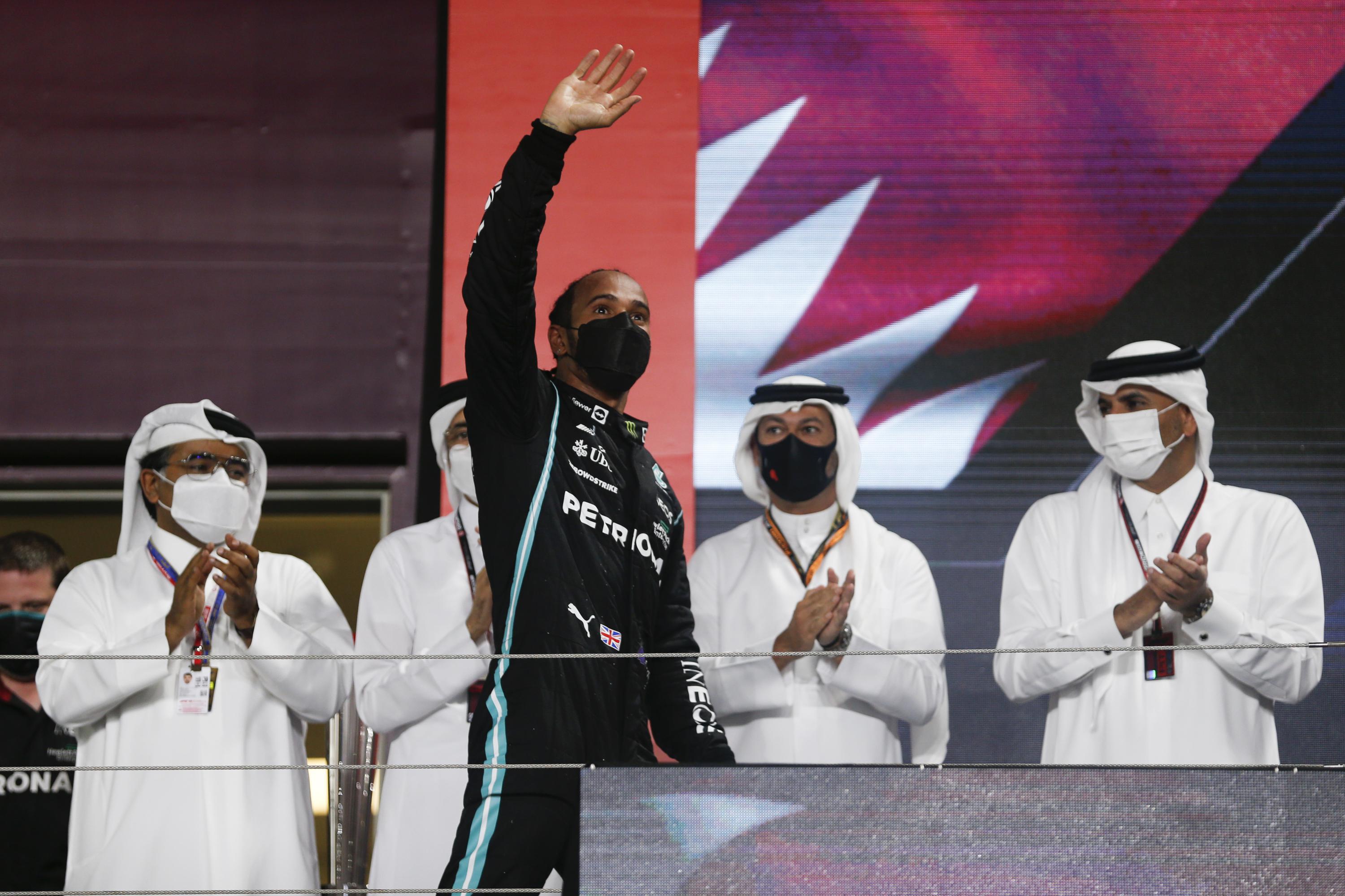 Hamilton wins in Qatar, slices into Verstappen points lead | AP News