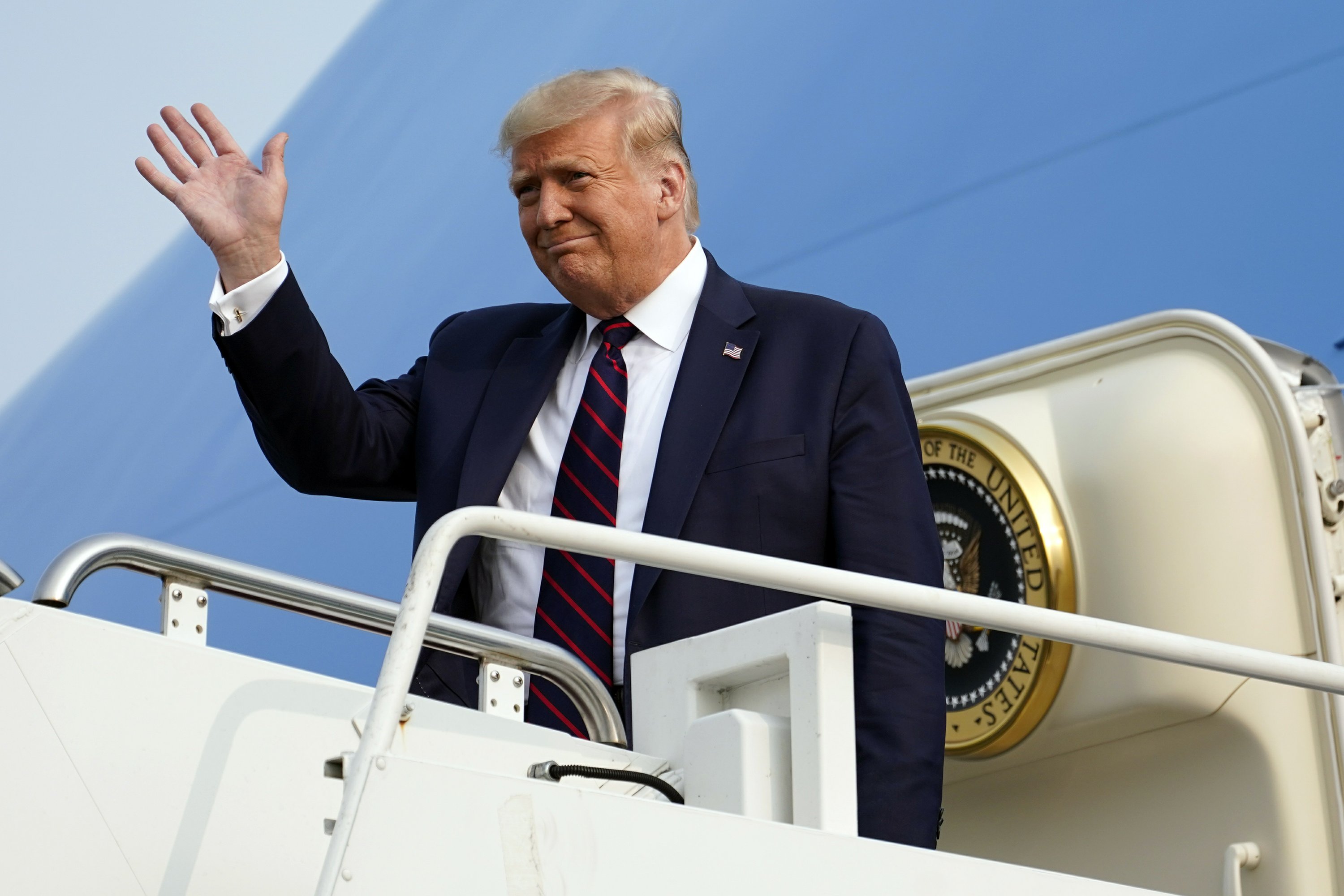 Trump opponents, supporters rally at town hall event site | AP News