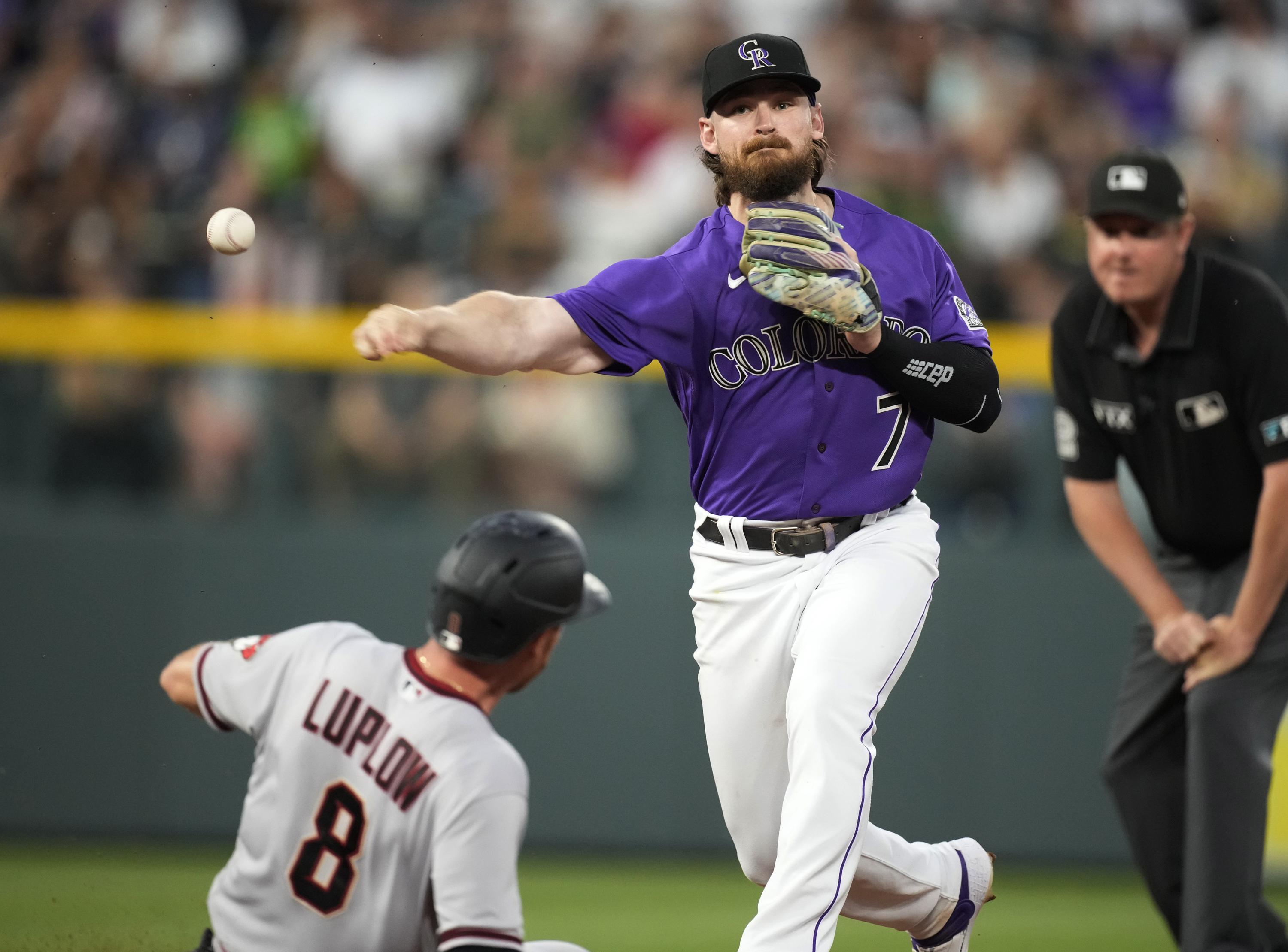 Rodgers, Joe power Rockies to 11-7 victory over Diamondbacks | AP News