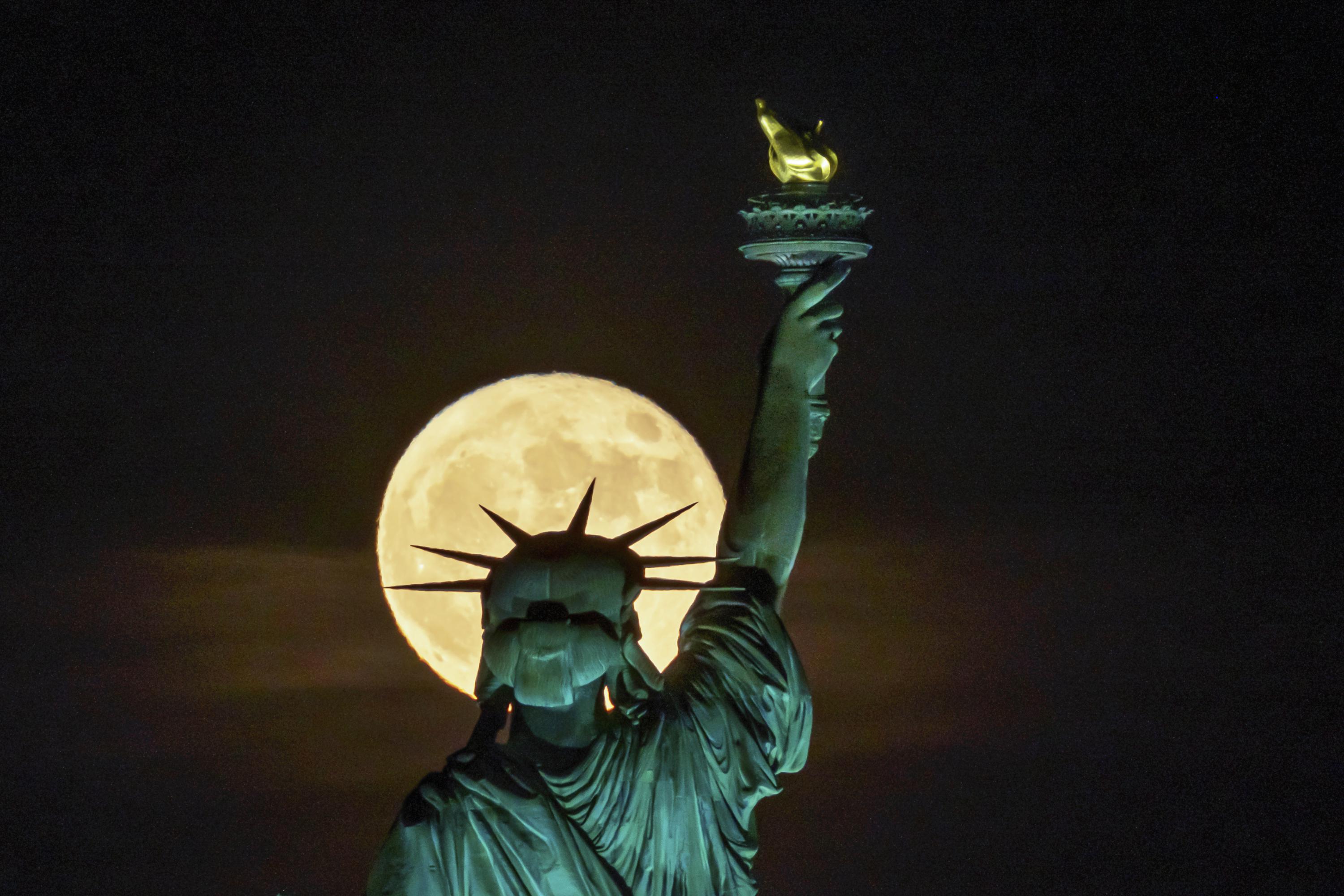 See photos of Strawberry Moon from around the globe | AP News