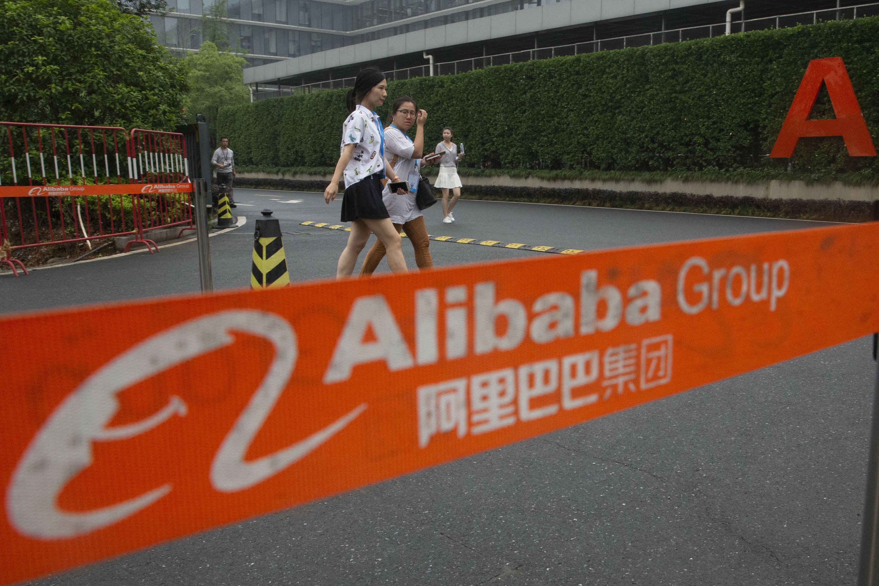 China steps up pressure on Alibaba with anti-monopoly probe | AP News