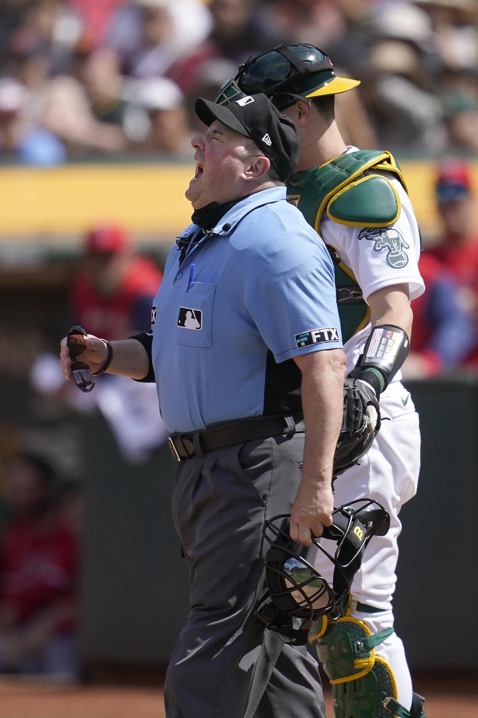 Plate ump leaves A's-Angels game after getting hit twice | AP News