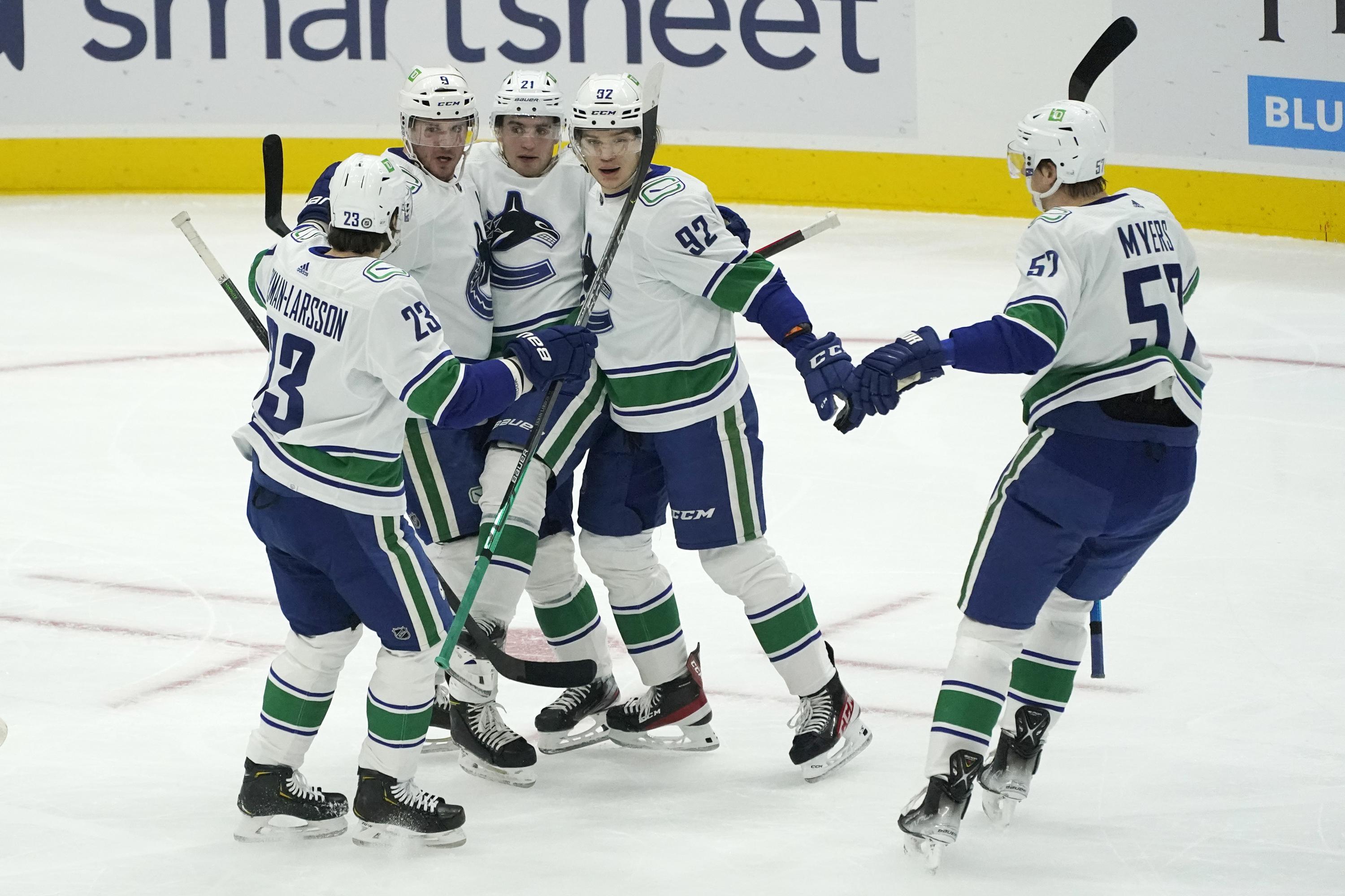 Canucks score 3 in third period to topple Kraken 5-2 | AP News