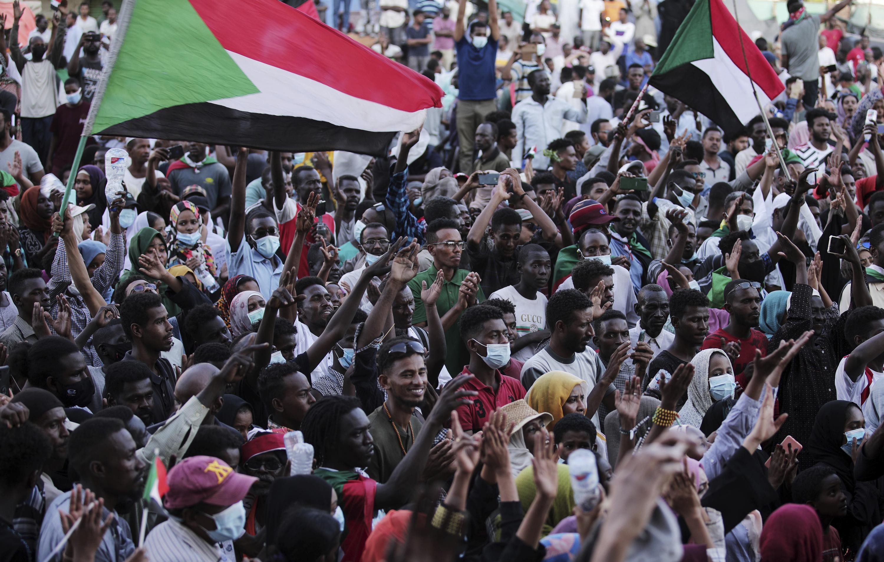 Tens of thousands protest Sudan's coup, 3 protesters killed | AP News
