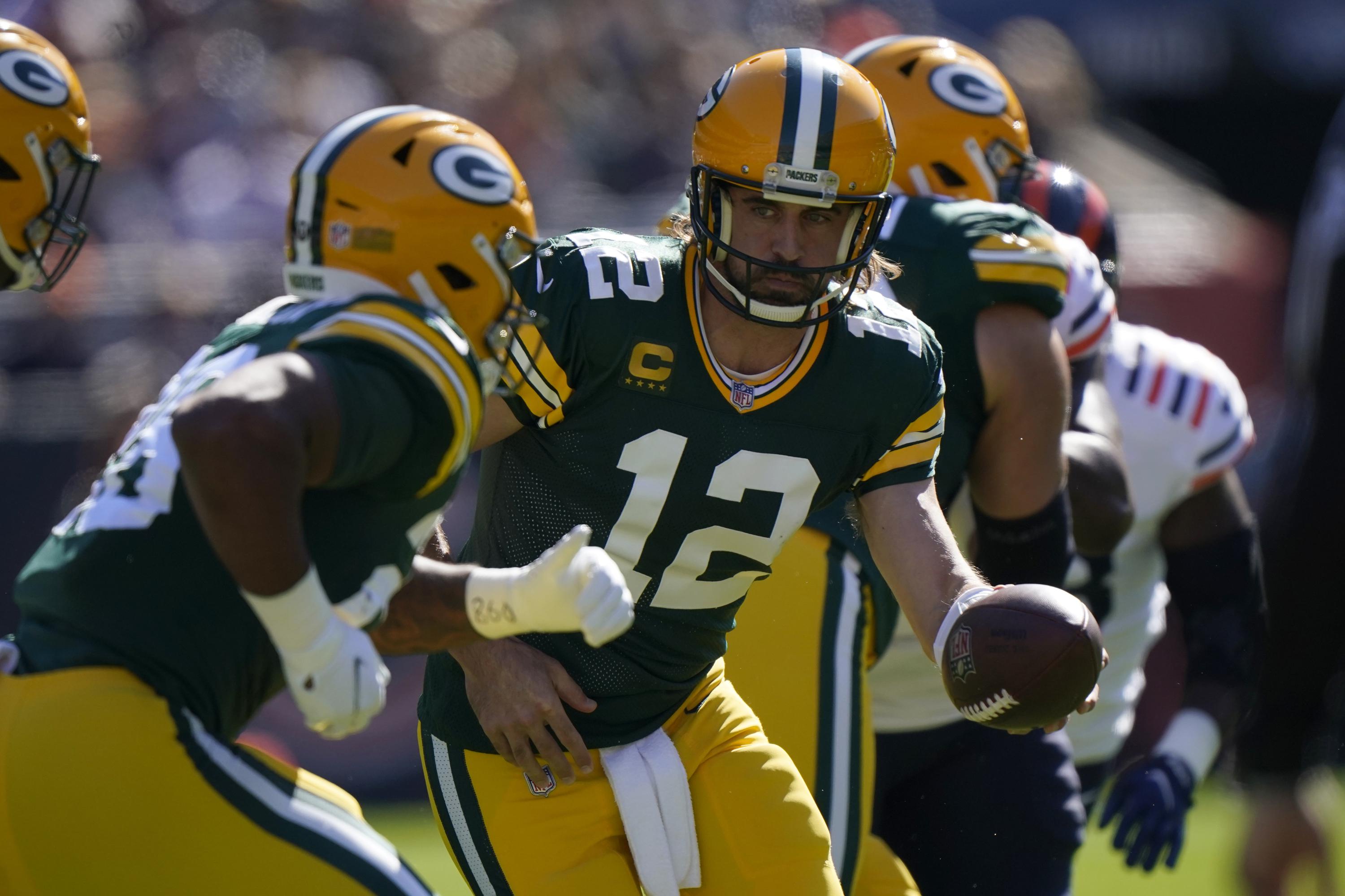 Rodgers throws 2 TDs, runs for 1 as Packers beat Bears 24-14 | AP News