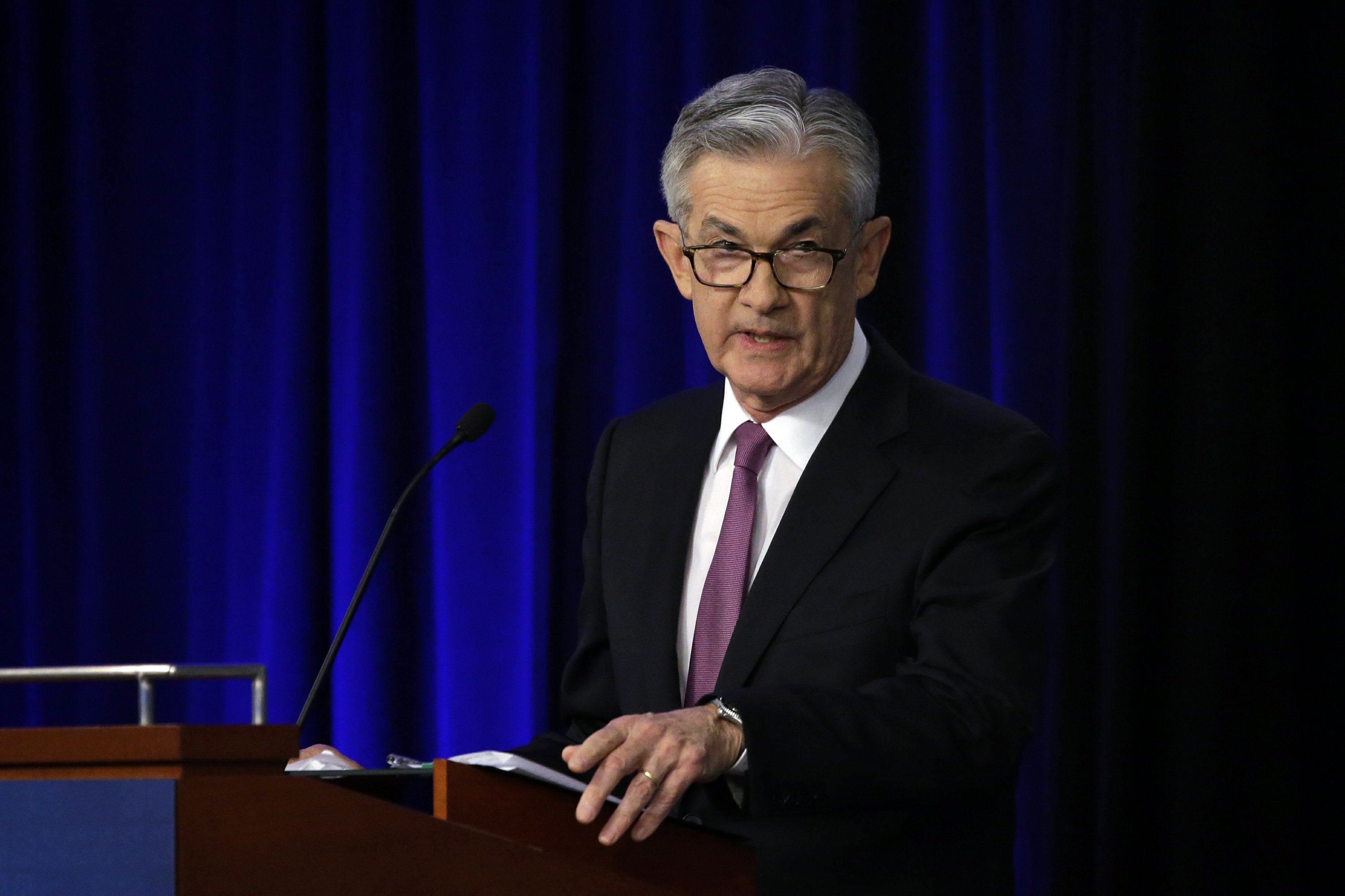 Fed leaves its key rate unchanged but hints of future cuts | AP News