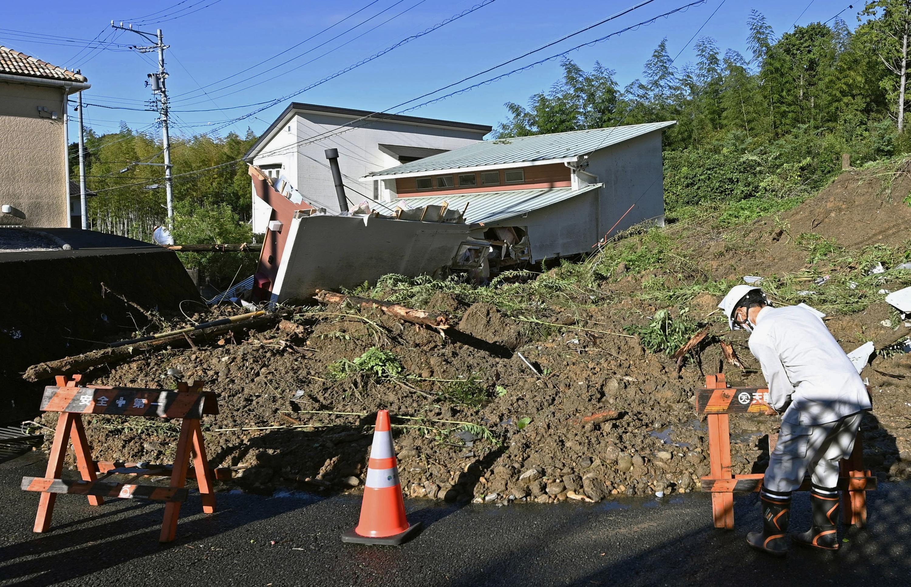 Storm pounds Japan with rain, leaving landslides in its wake | AP News