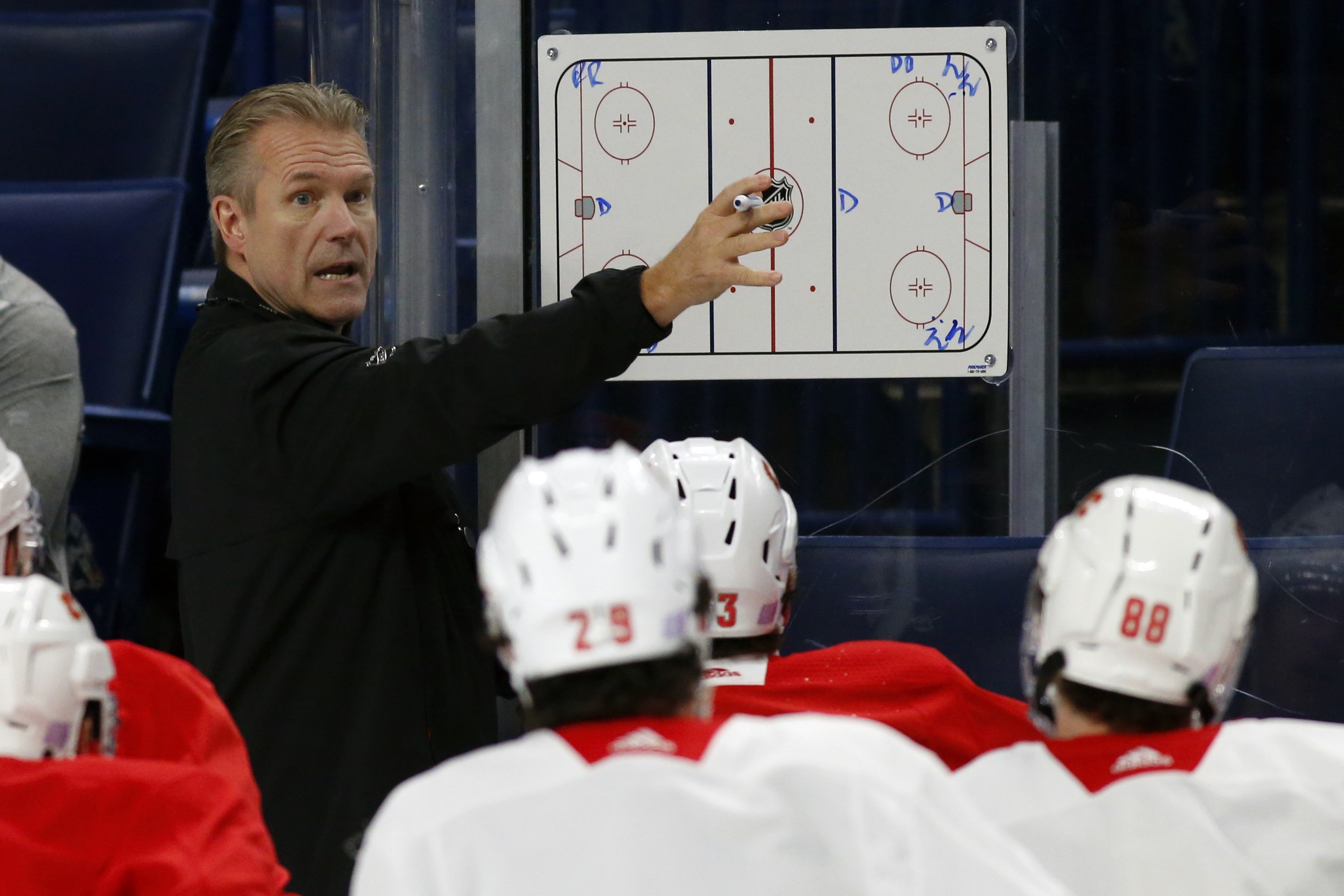 Flames coach apologizes for language used with black player | AP News