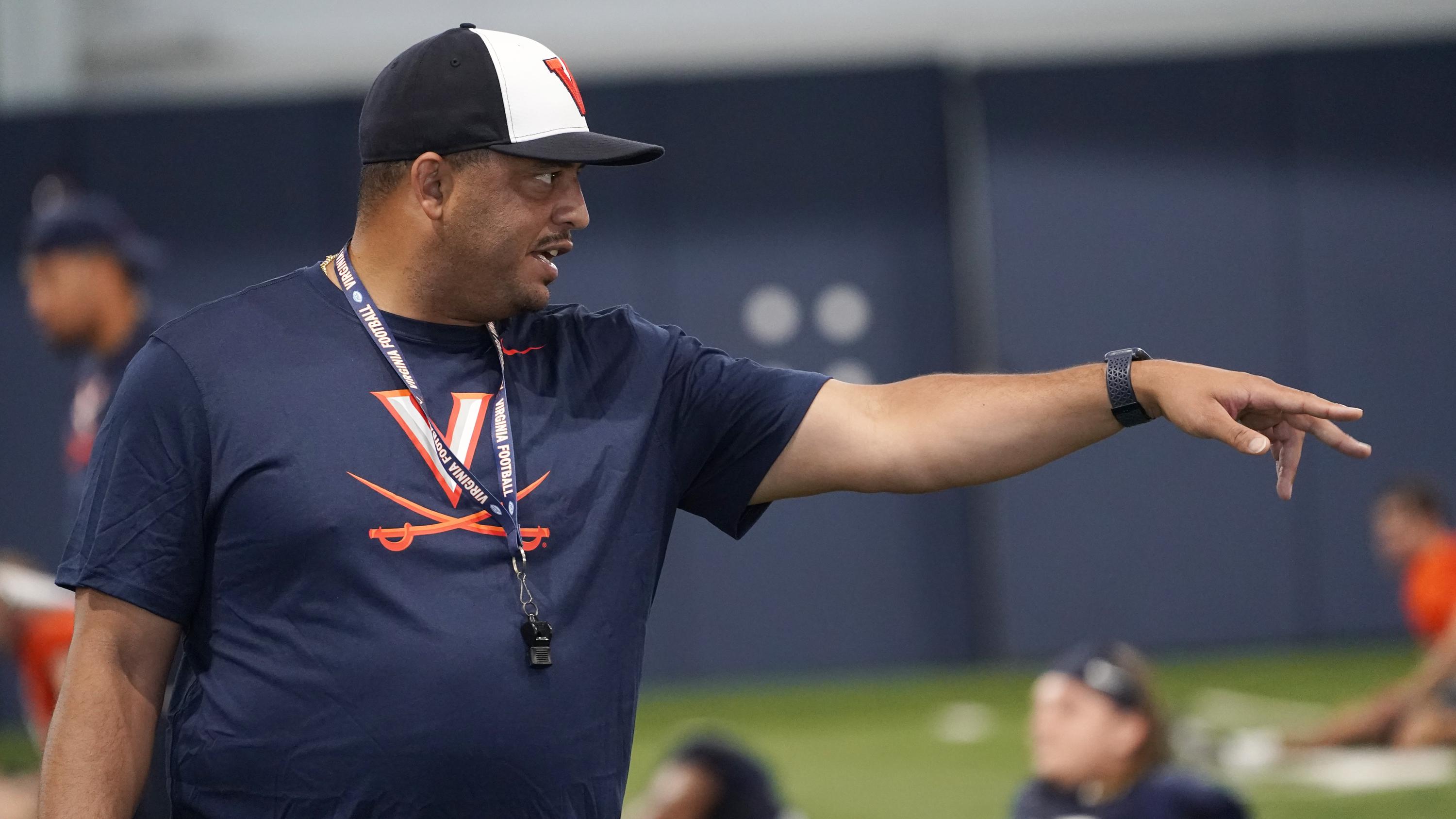 Virginia seeks better start for new coach against Spiders | AP News