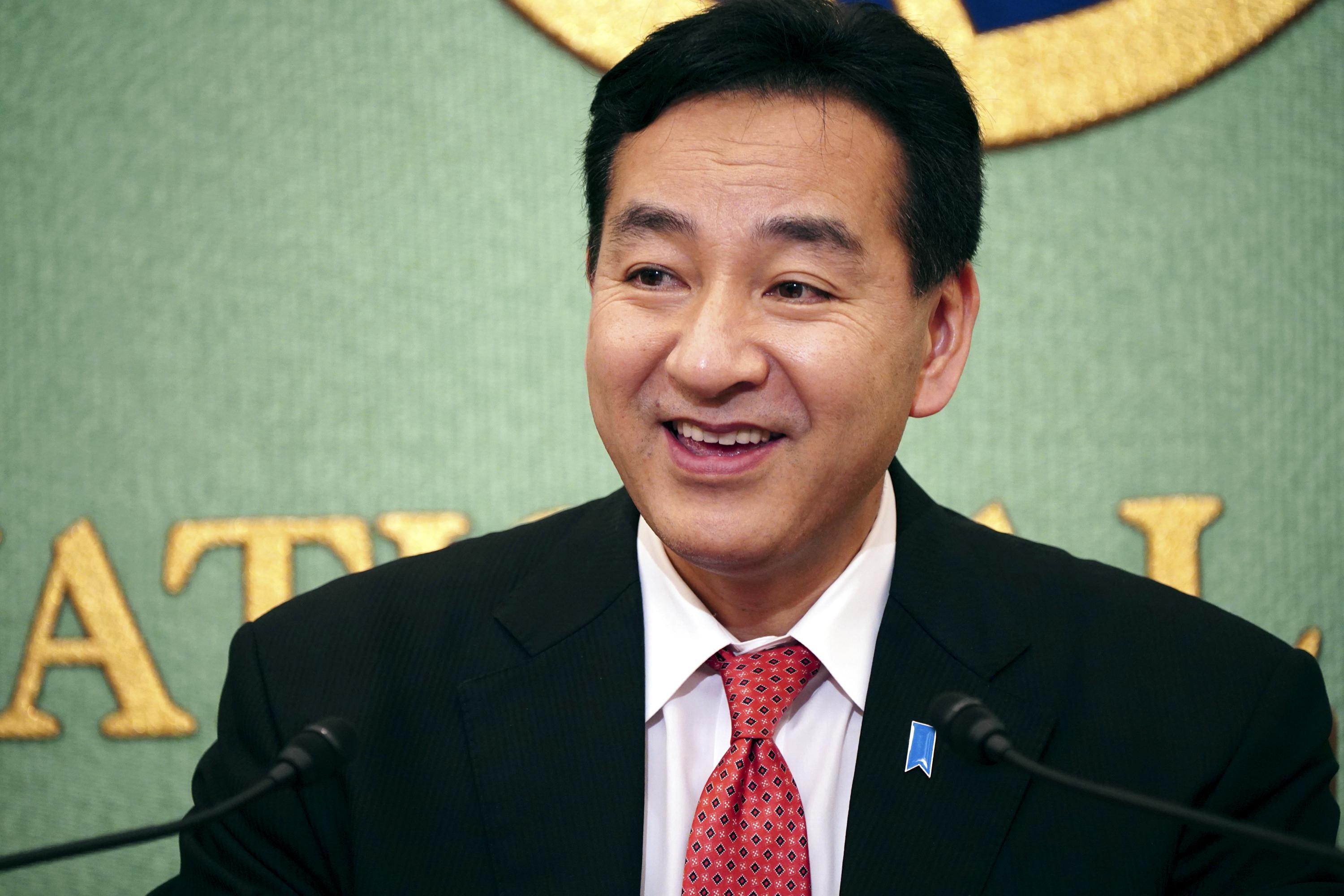 Japan minister aims to control COVID while achieving growth | AP News
