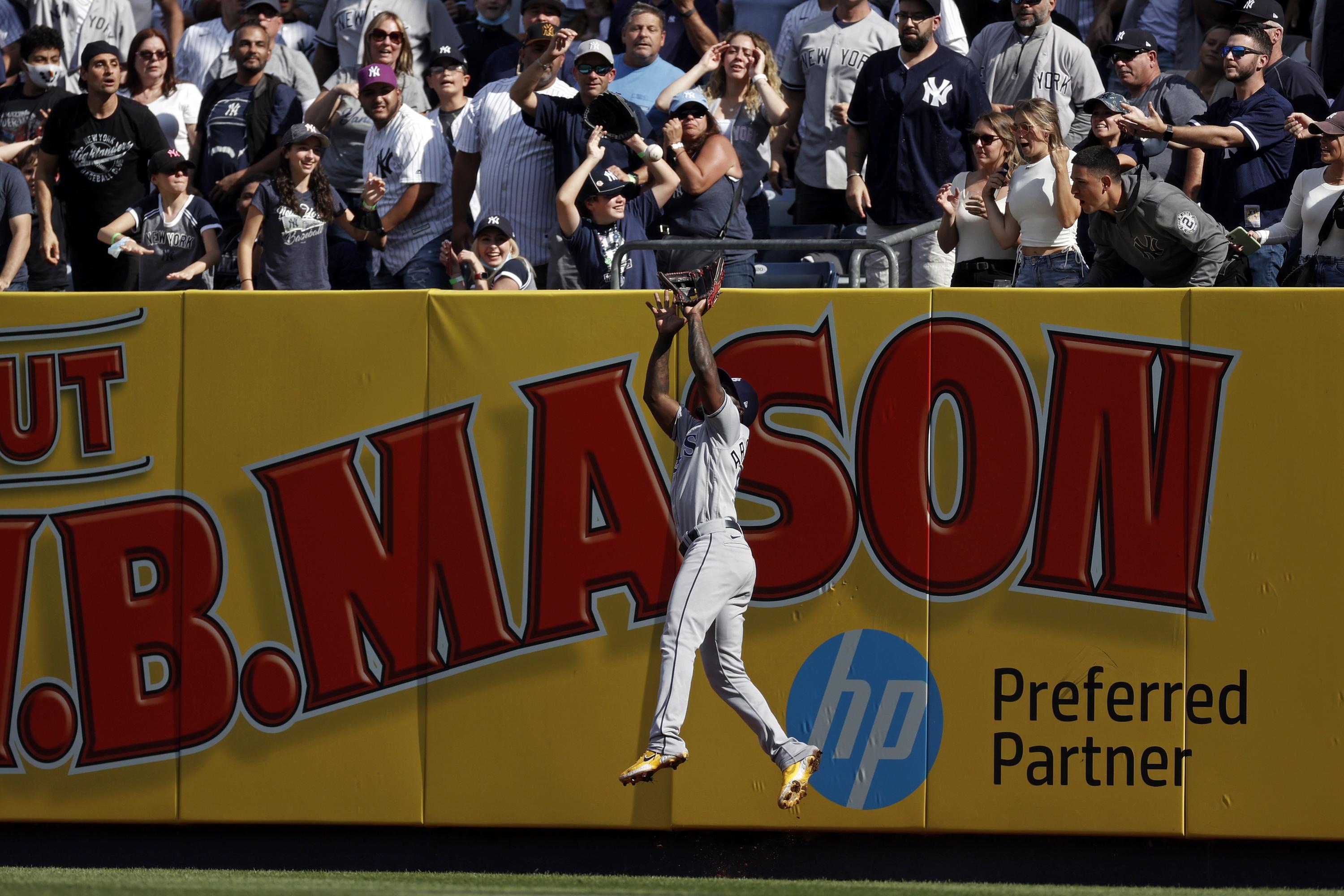 Full house: Fans flow, home-field edge back for MLB playoffs | AP News