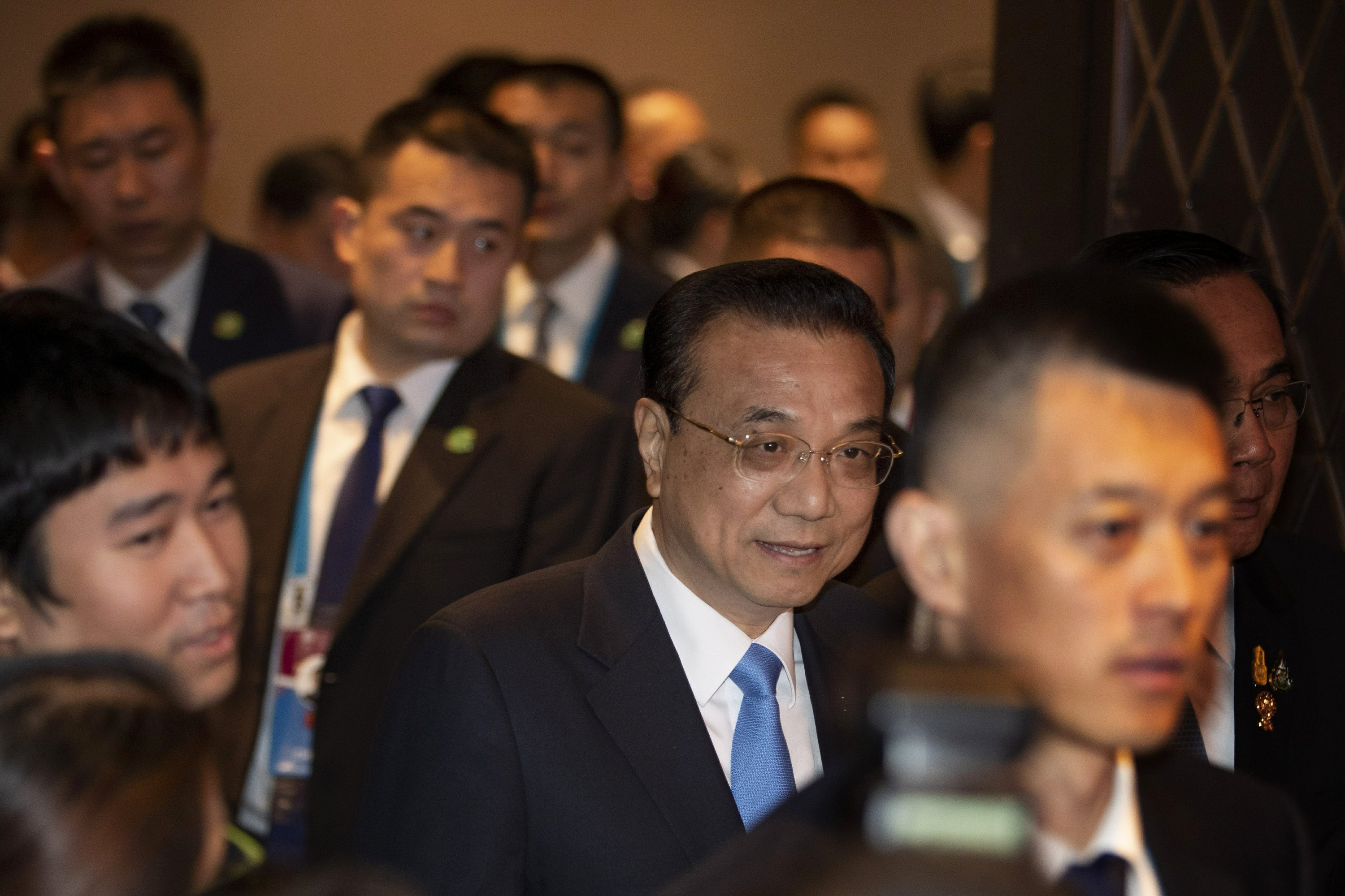 Trump absent, ASEAN charts path for trade bloc led by China | AP News