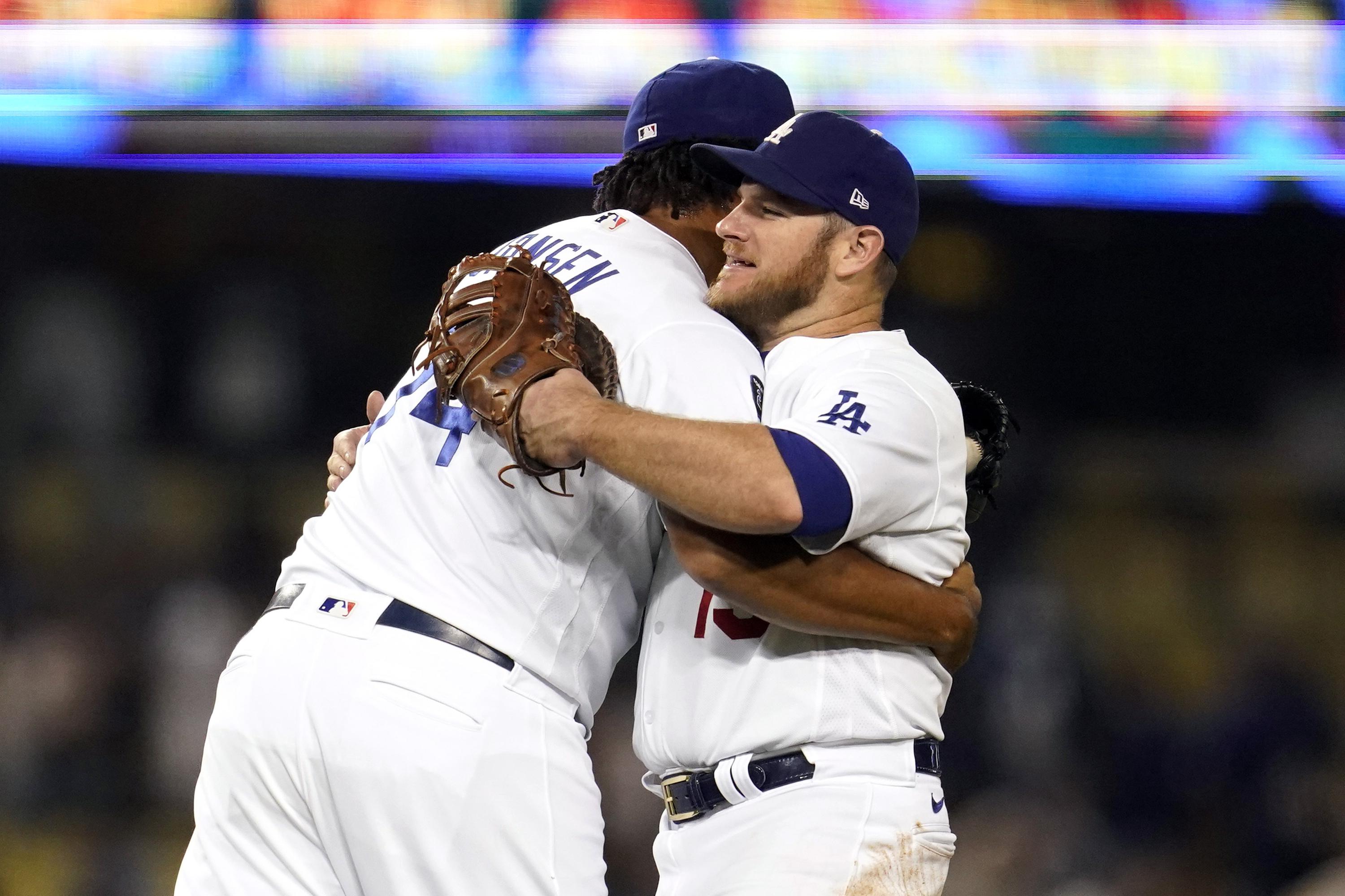 Dodgers clinch postseason berth in 8-4 win over D-backs | AP News