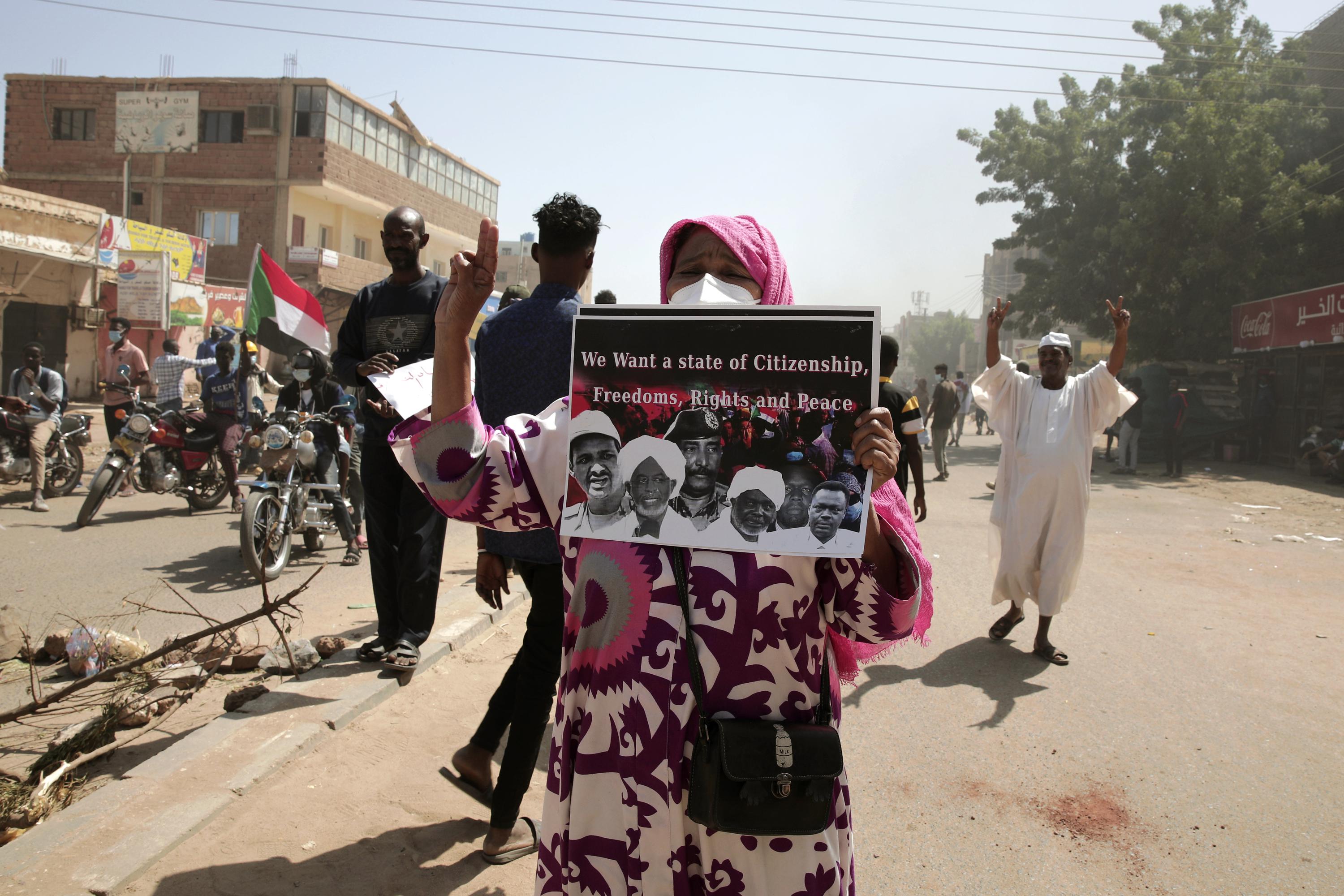Thousands march on anniversary of Sudan coup, 1 killed | AP News