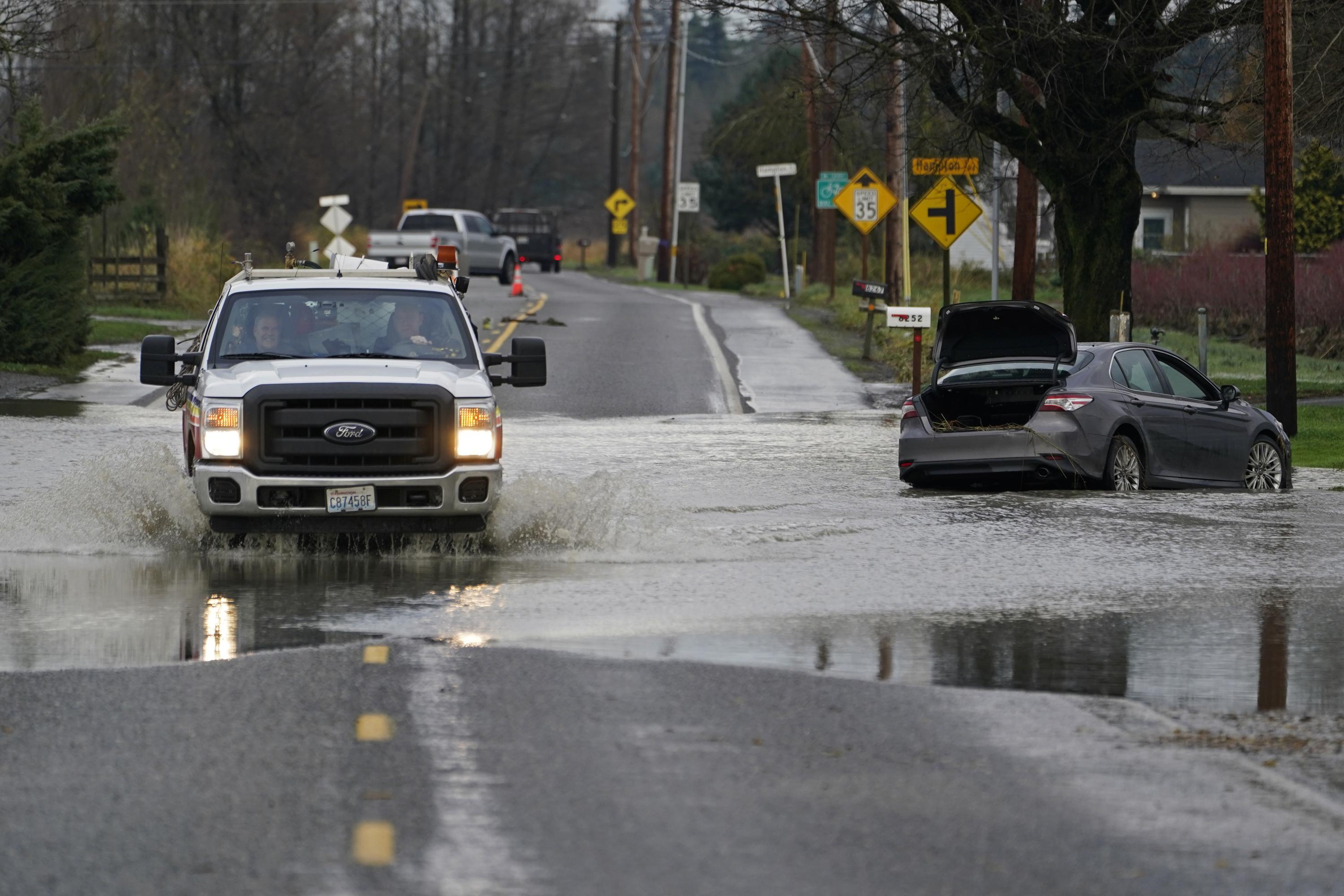 Washington state sees more flooding, next storm approaches | AP News