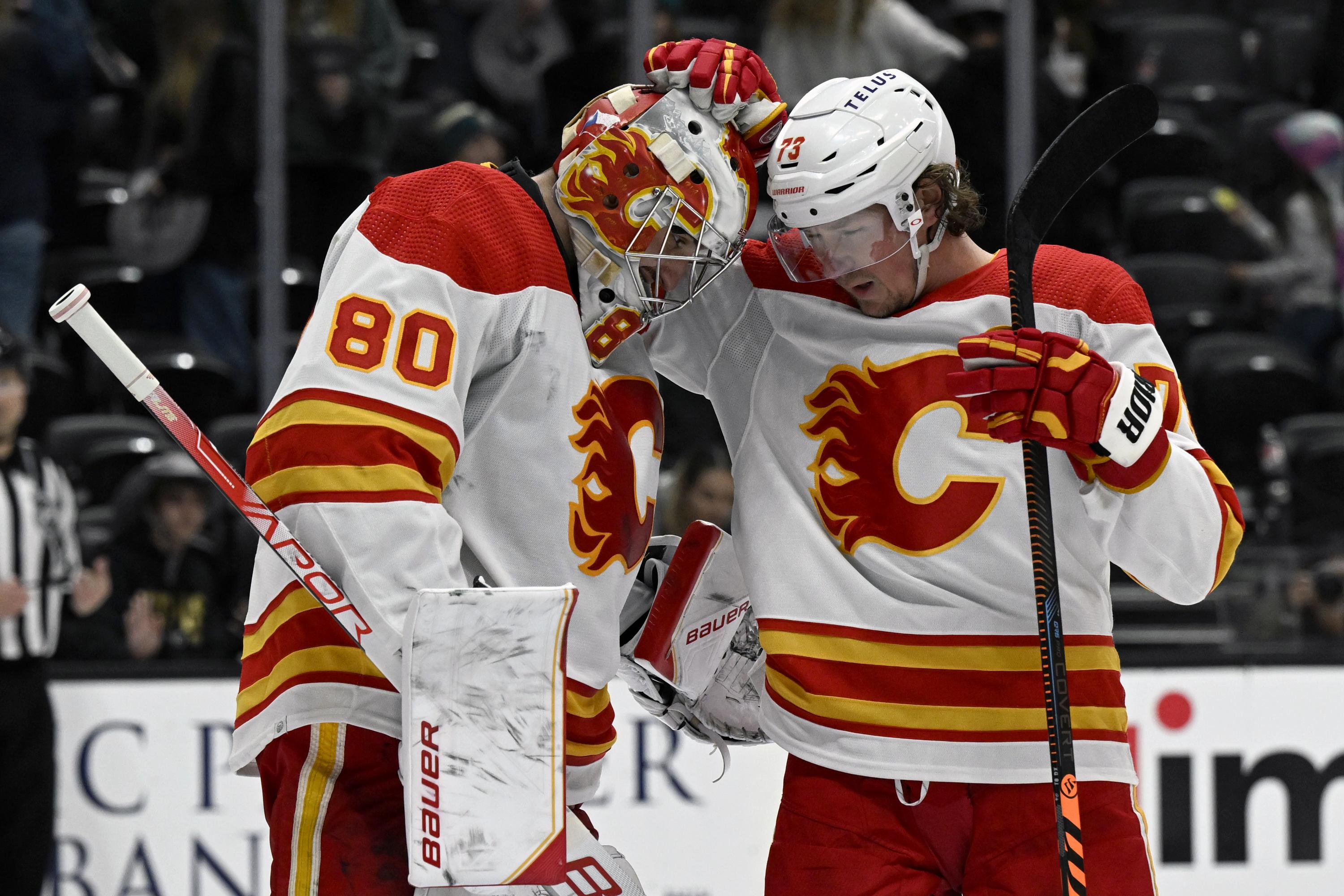 Flames bounce back with 5-1 victory over Ducks | AP News