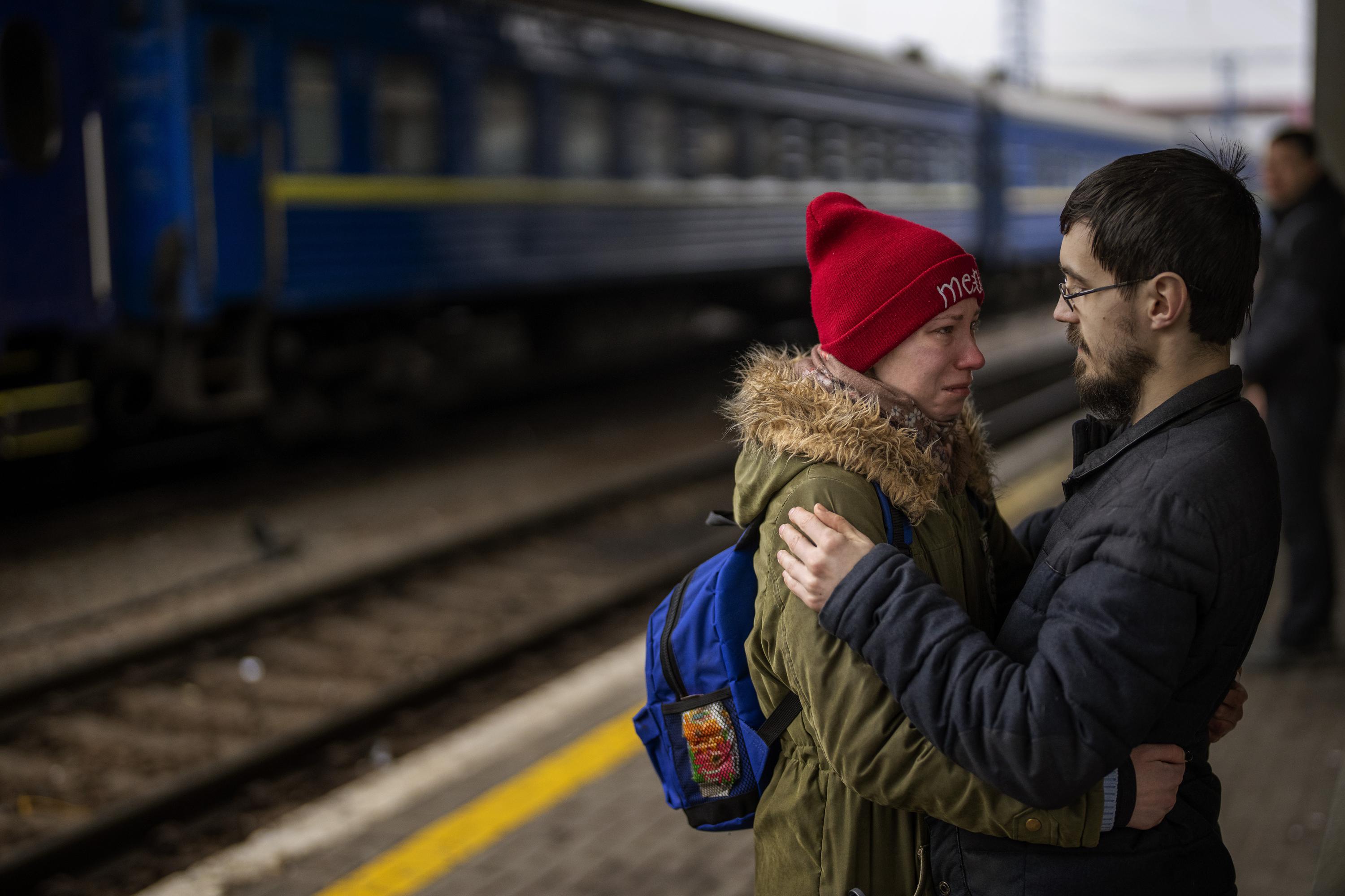 Tearful goodbyes at Kyiv train station during war in Ukraine | AP News