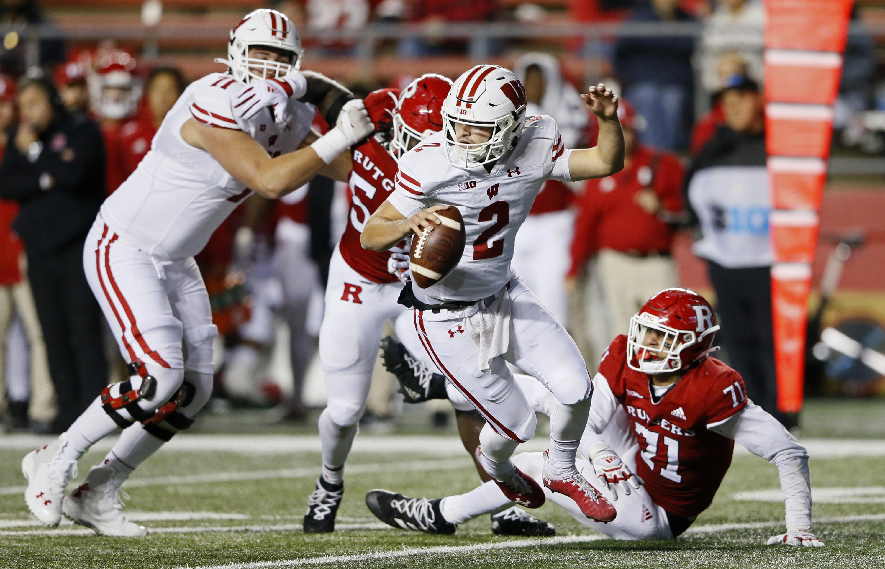 Wolf's injury hinders No. 18 Wisconsin's quarterback depth | AP News