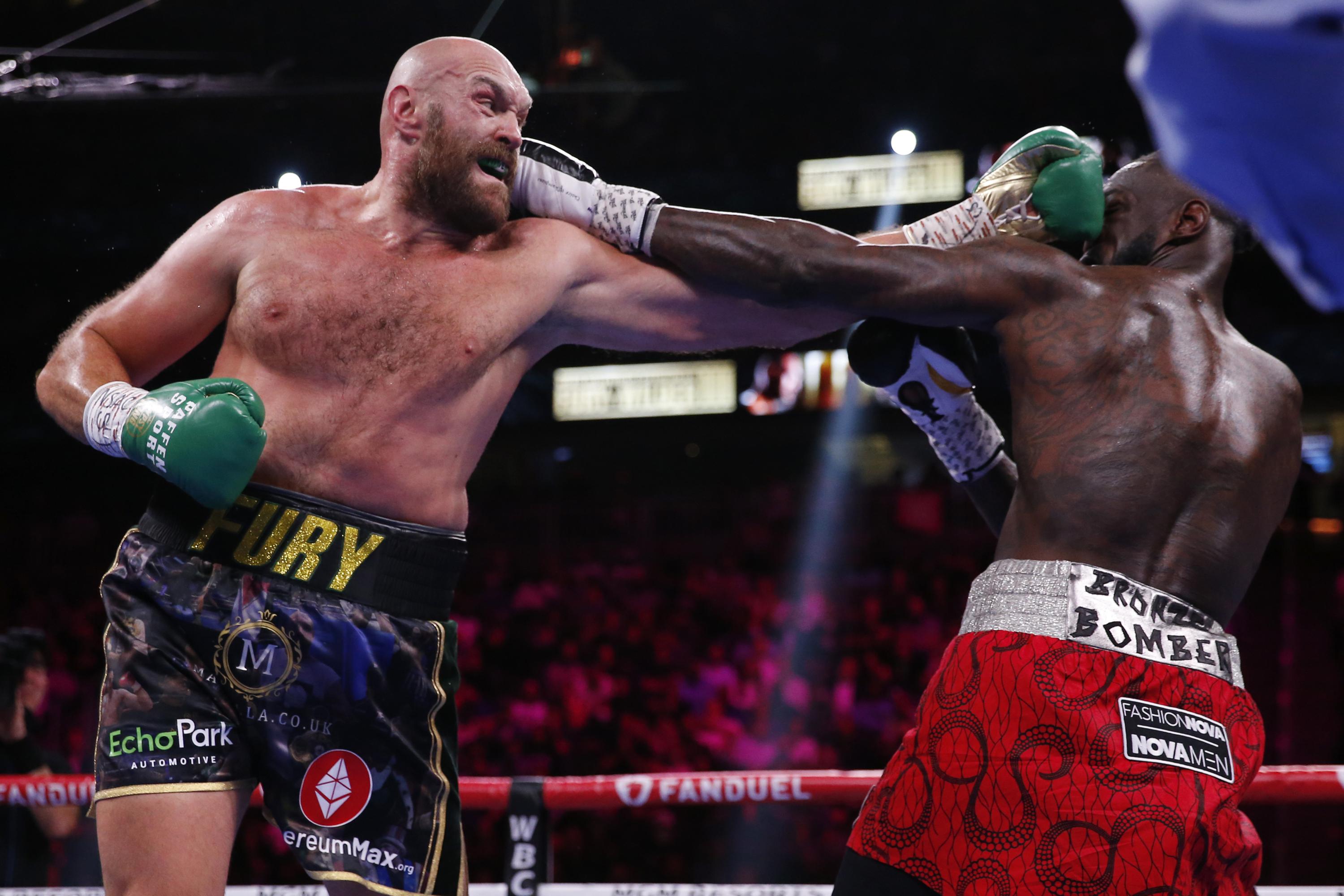 Fury defenderá título ante Whyte en el Wembley en abril | AP News