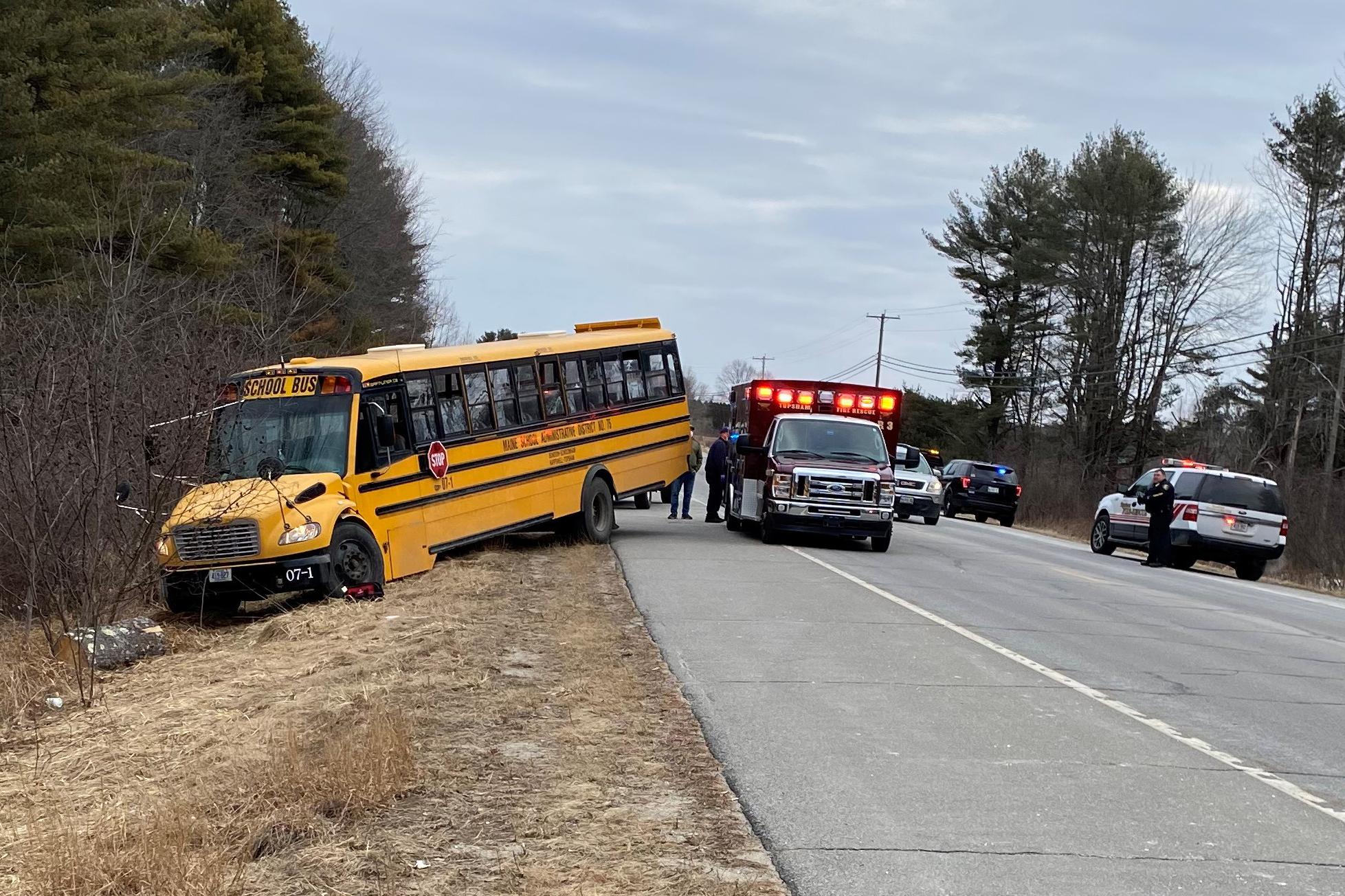 Students steer school bus to safety after driver collapses | AP News