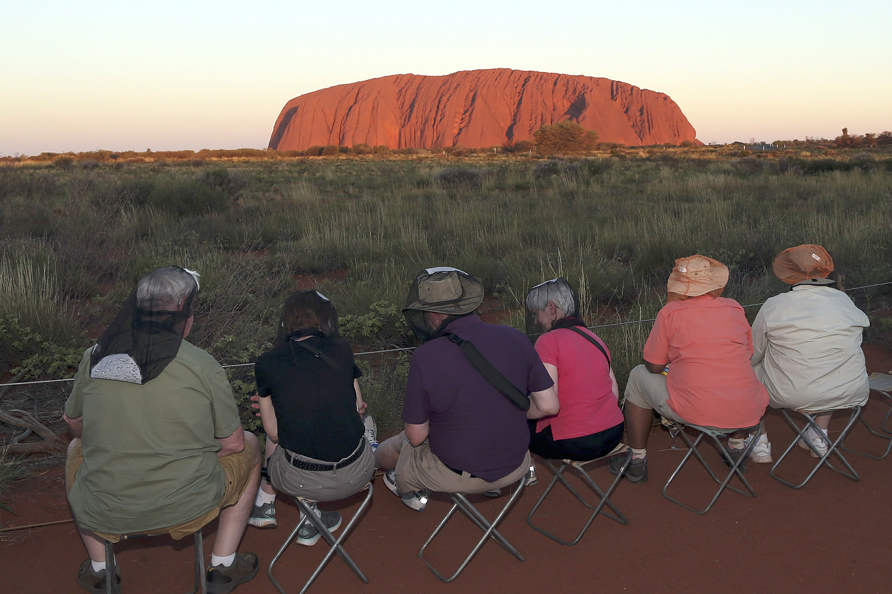 Australia's iconic rock Uluru scaled by final climbers | AP News