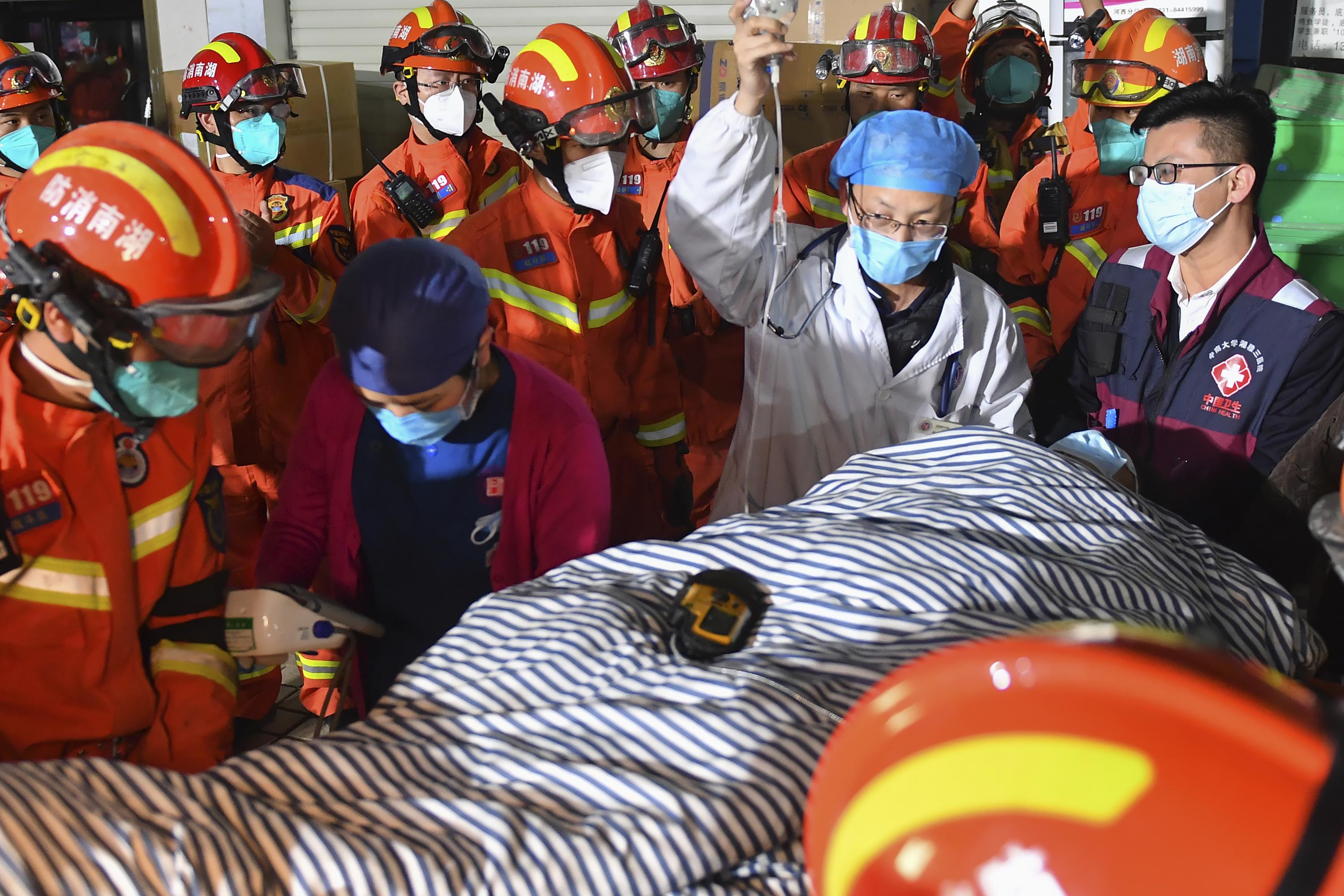 2 more survivors found 3 days after China building collapse | AP News