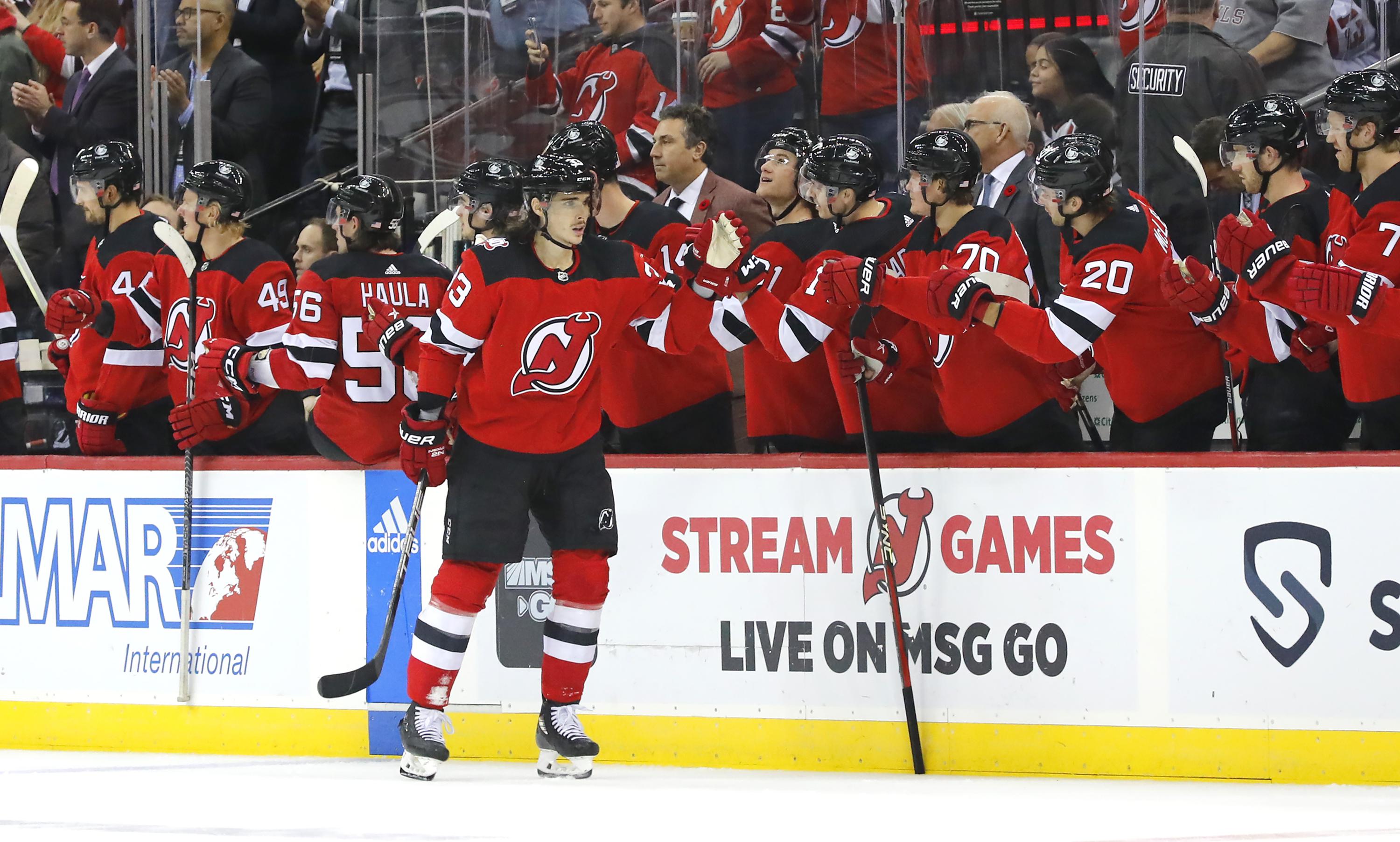 Devils beat Flames 3-2 on Hischier goal for 7th win in row | AP News