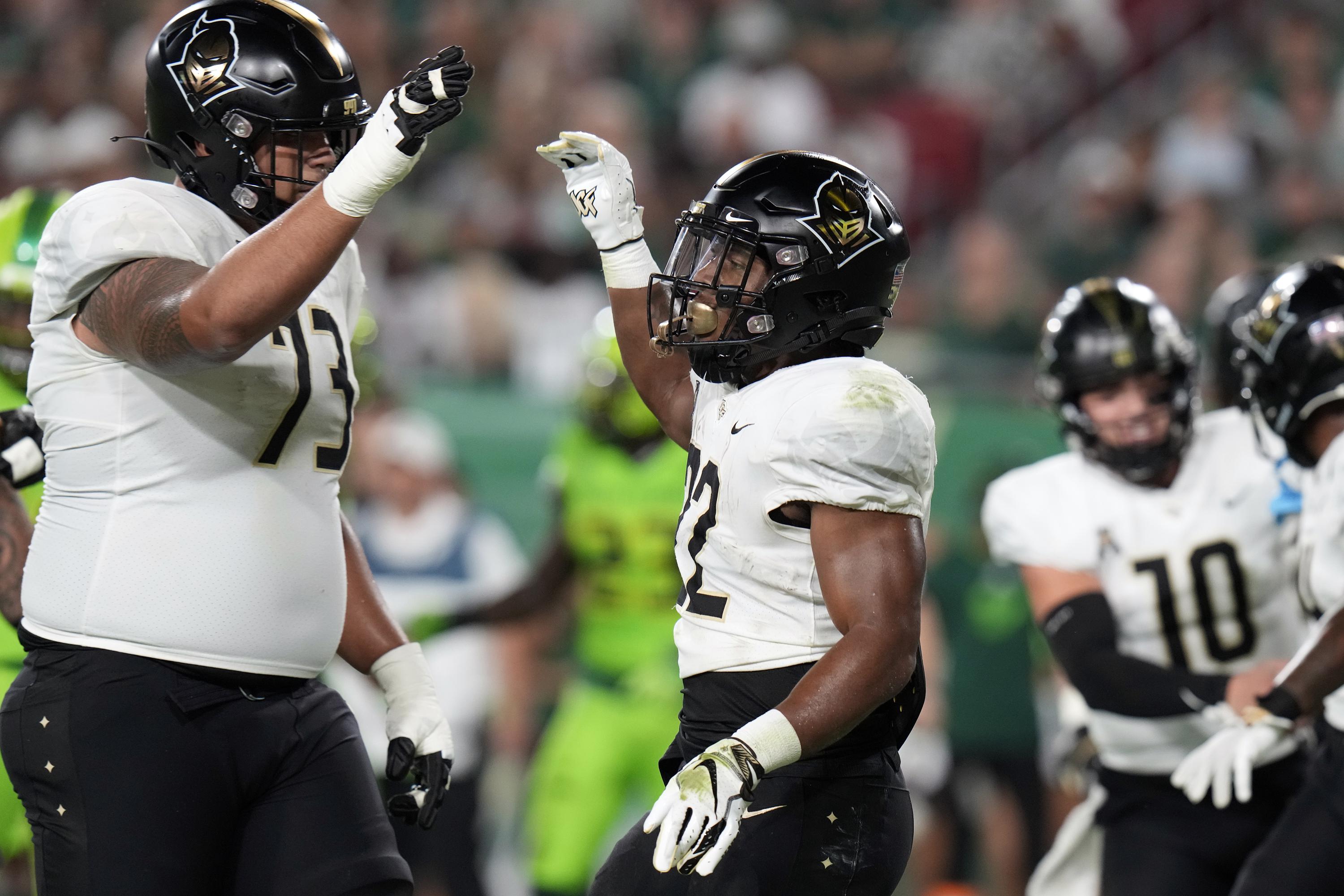 No. 25 UCF beats rival USF 46-39 to reach AAC title game | AP News