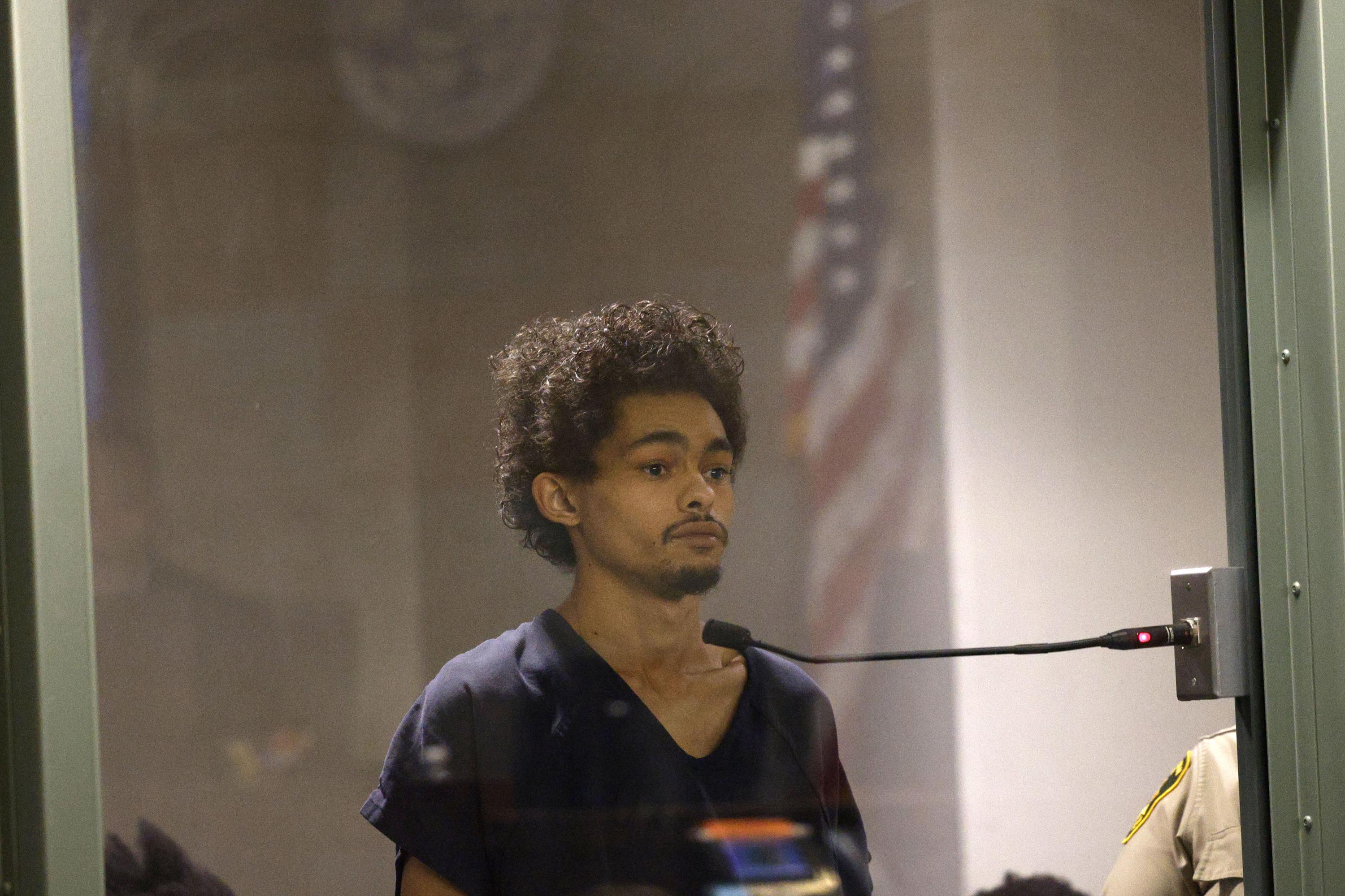 Prosecutor: Man held in Vegas officer killing fired 18 shots | AP News