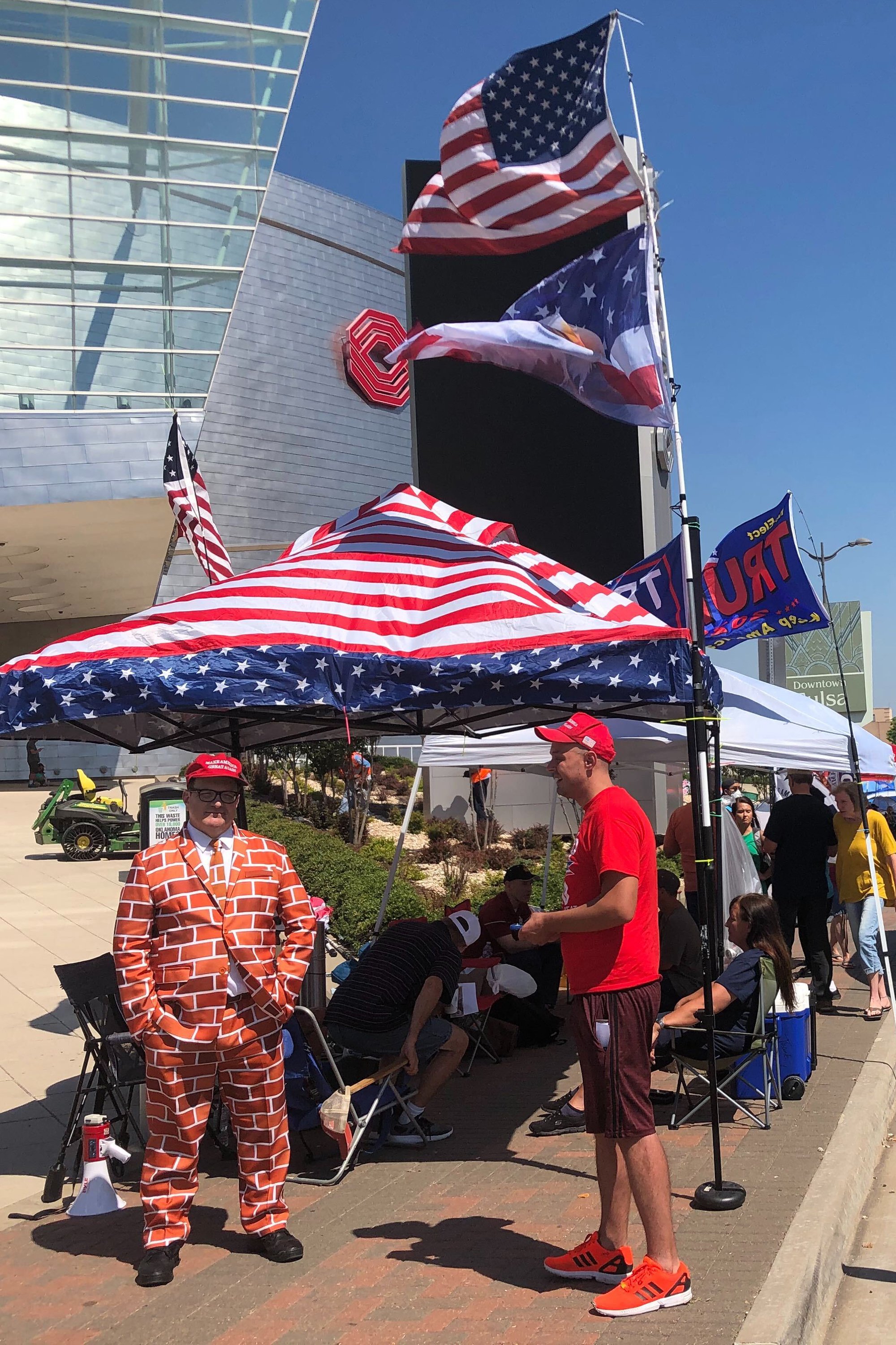 Heat, virus no deterrent for Trump fans camped outside arena | AP News