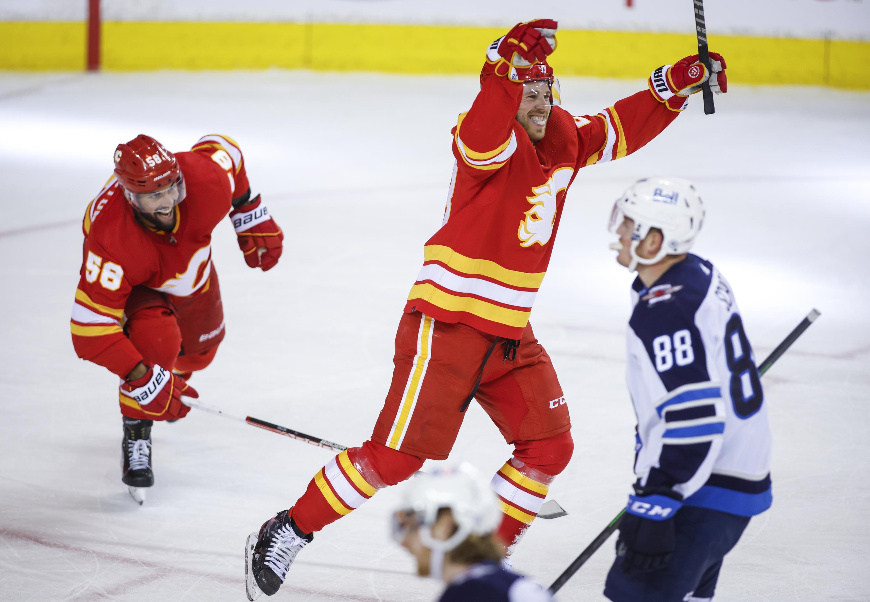 Flames top Jets to extend winning streak to 10 games | AP News