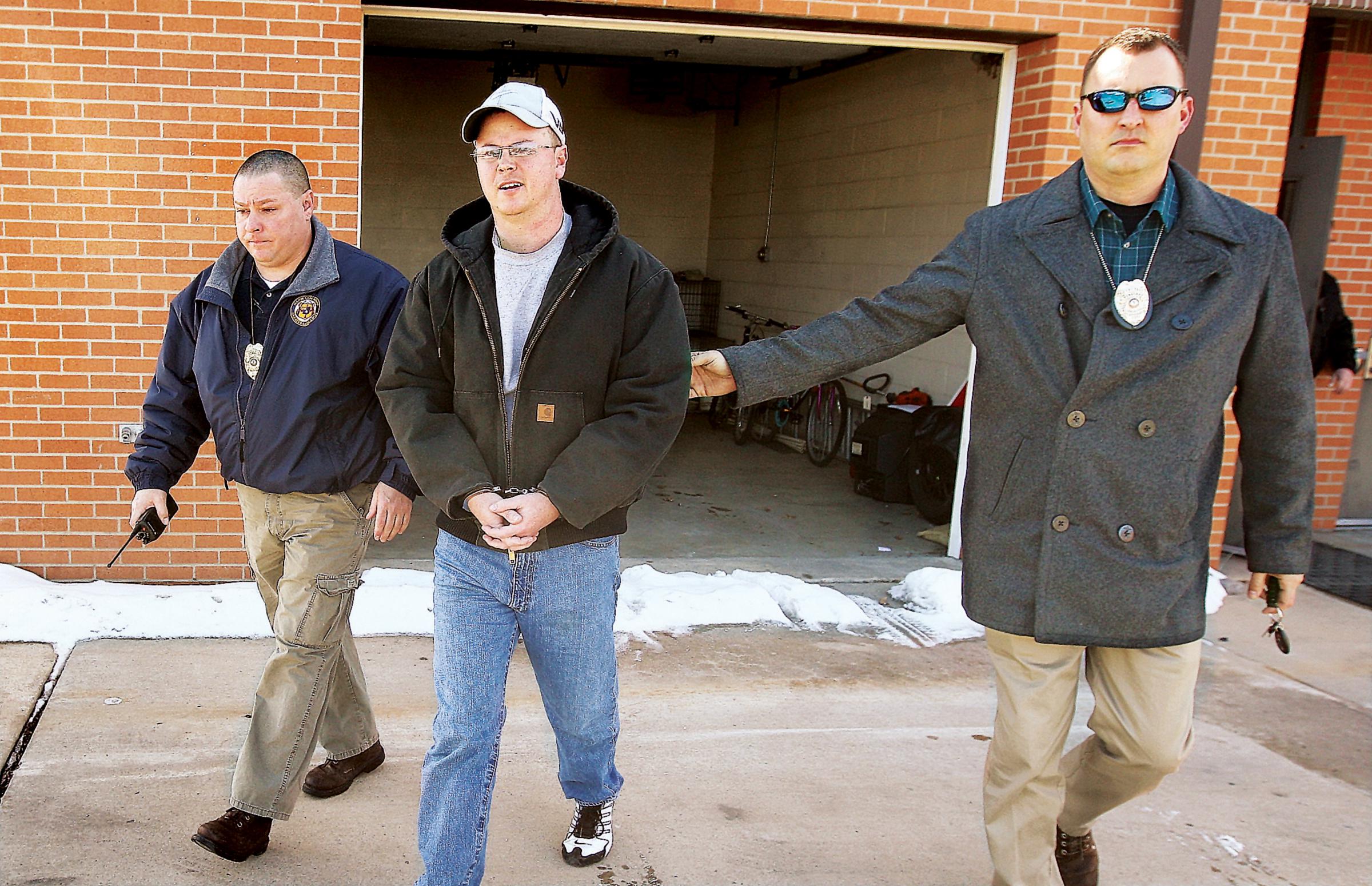 Bank official held in alleged fake robbery case | AP News