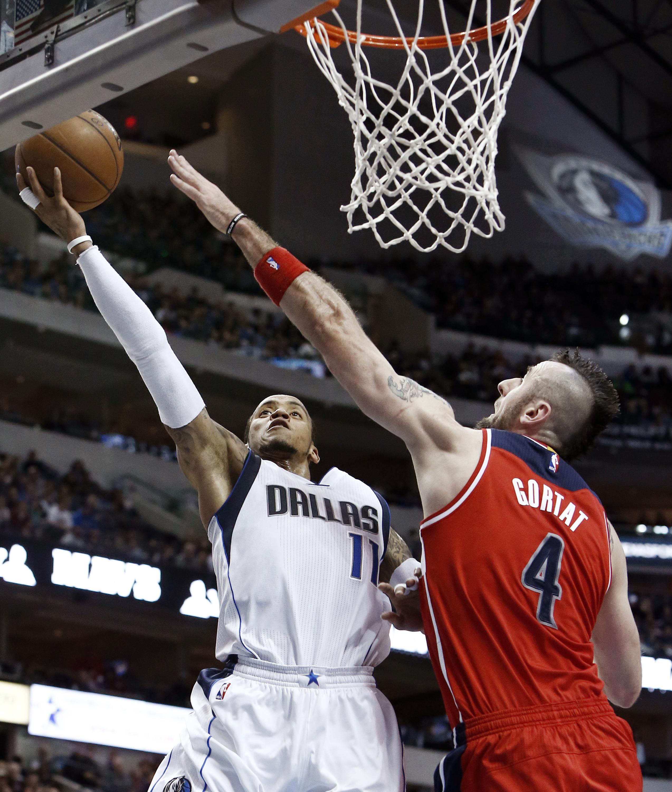 Ellis leads Mavericks to 114-87 rout of Wizards | AP News