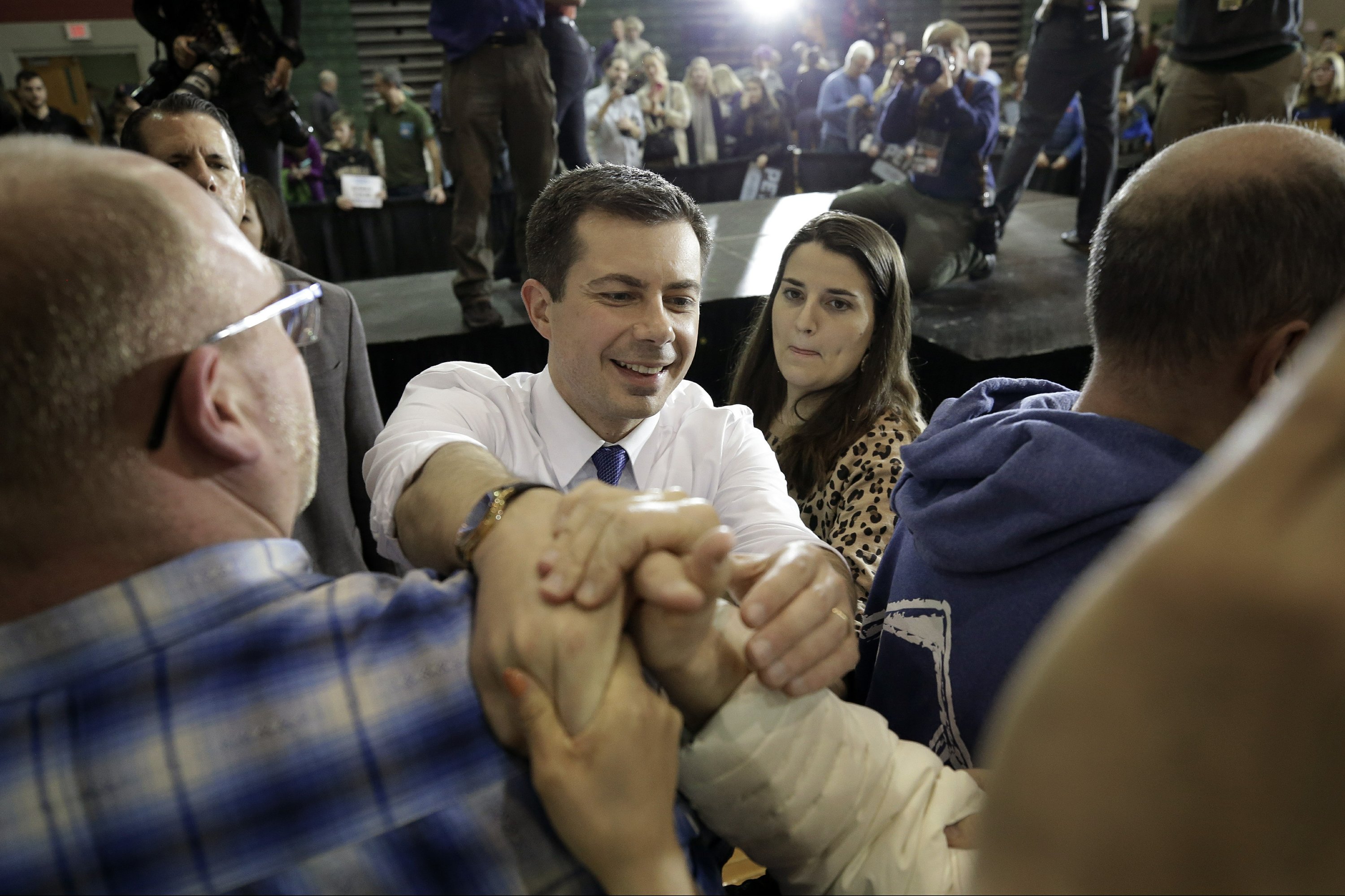 Buttigieg on defense as rivals aim to blunt his momentum | AP News
