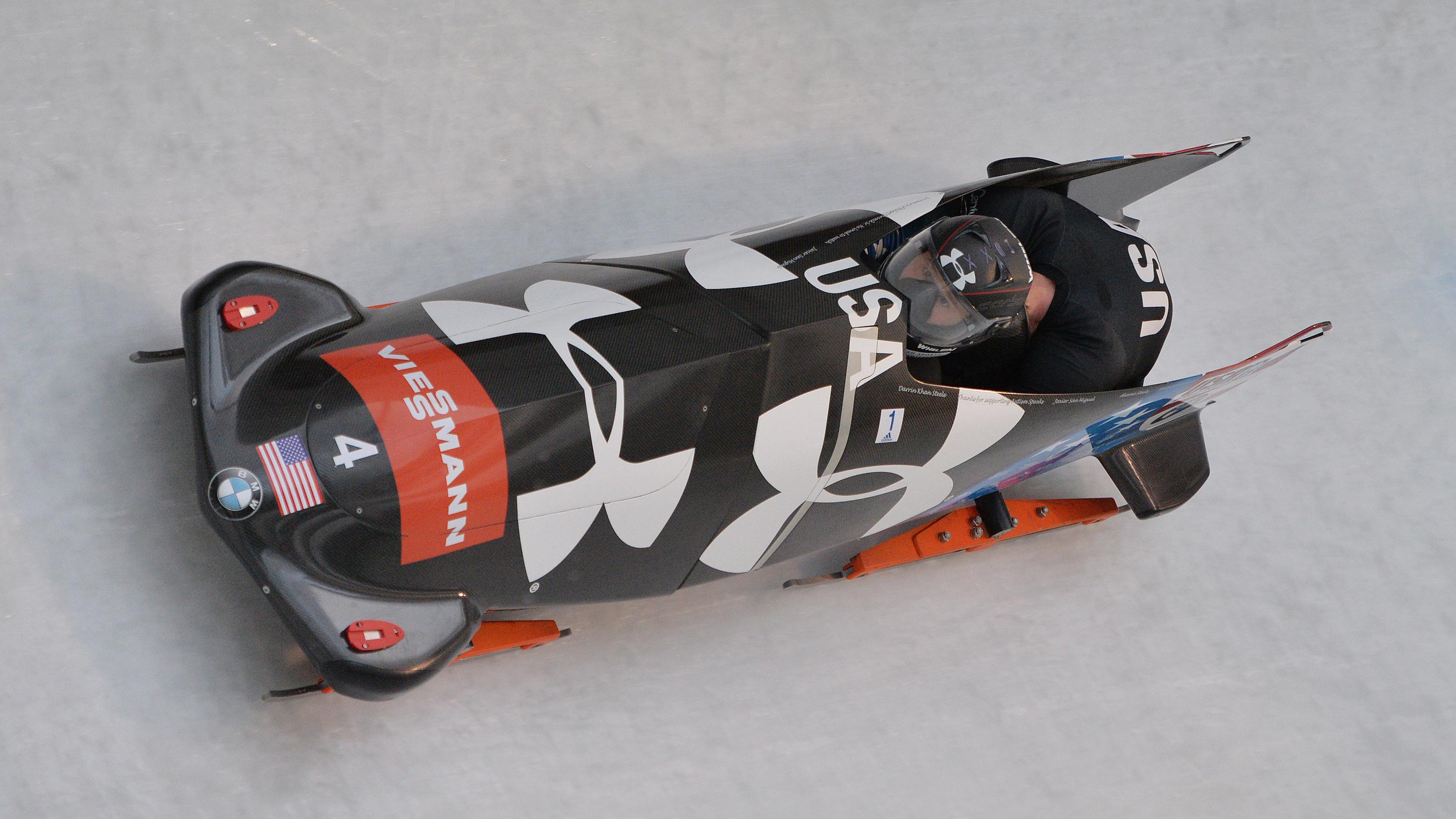 Holcomb wins 2-man race, ends European drought | AP News