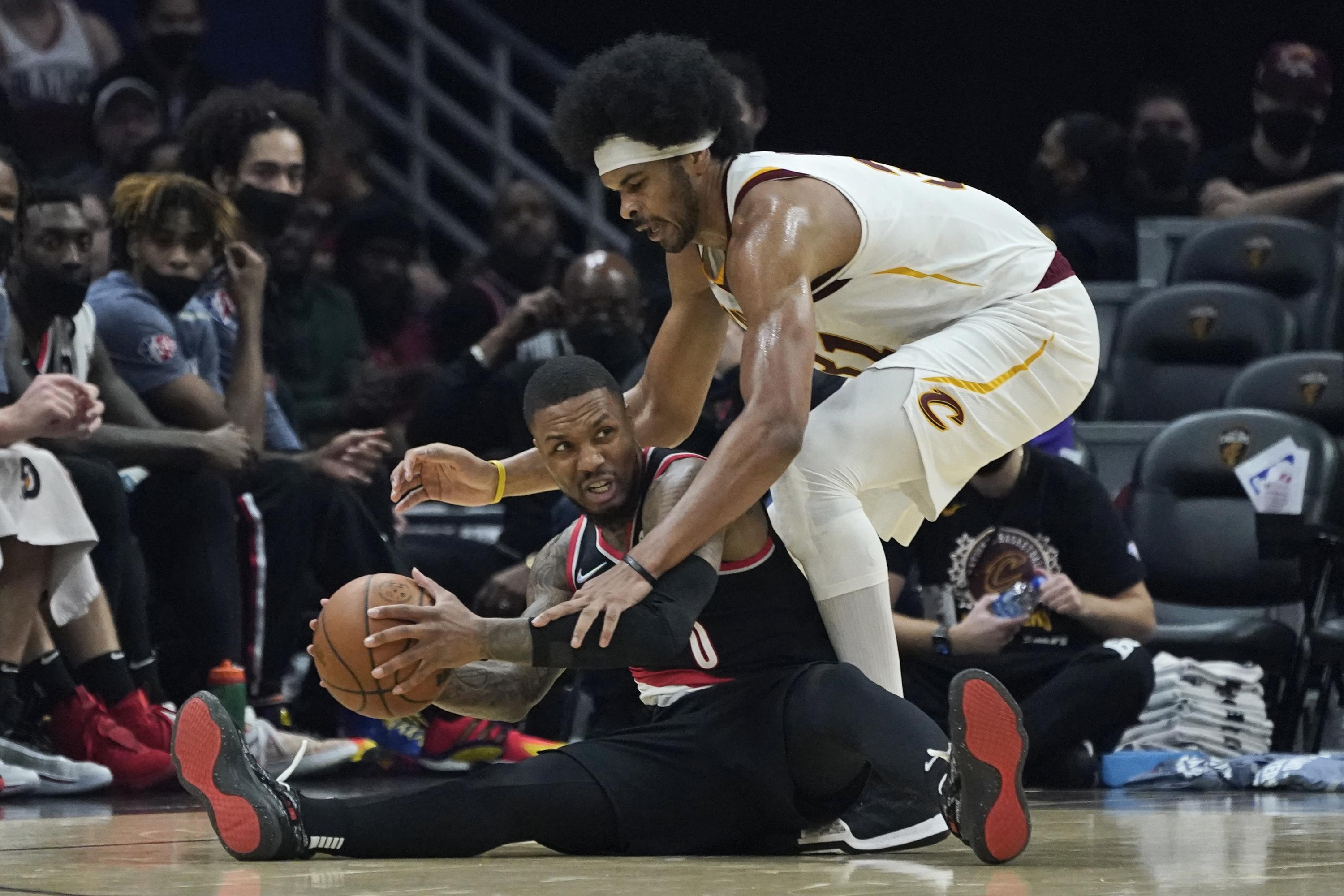 Allen, Mobley power Cavaliers to 107-104 win over Portland | AP News